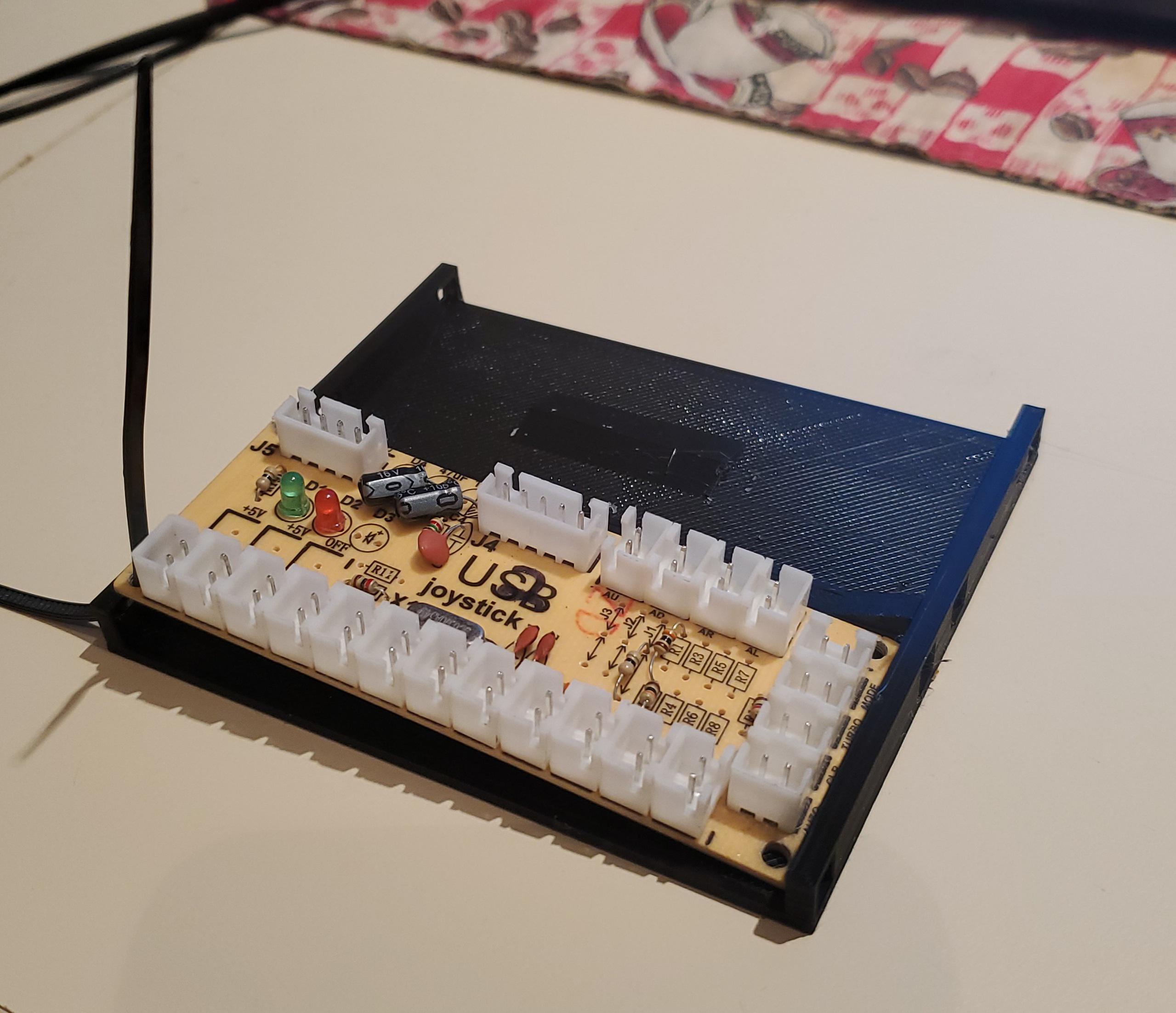CrapMAME engineering: a 3D printed board to hold 2 Dragonrise USB boards, using cable ties ...