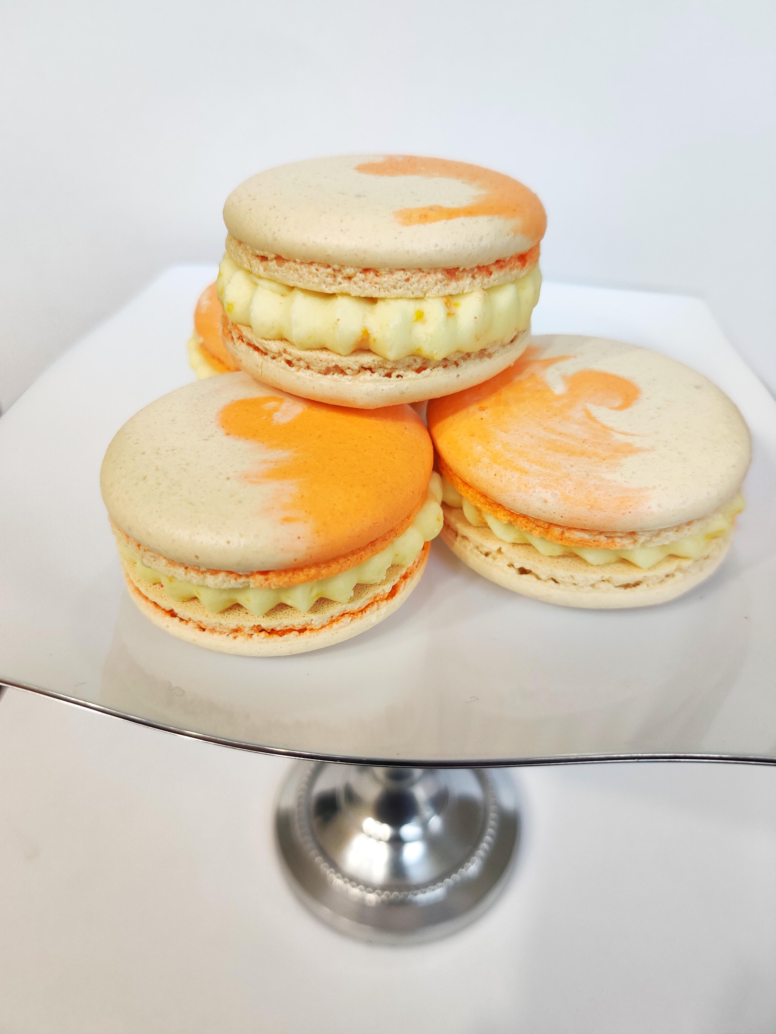 Creamy orange macarons! Filled with vanilla orange buttercream and homemade orange curd. | Scrolller
