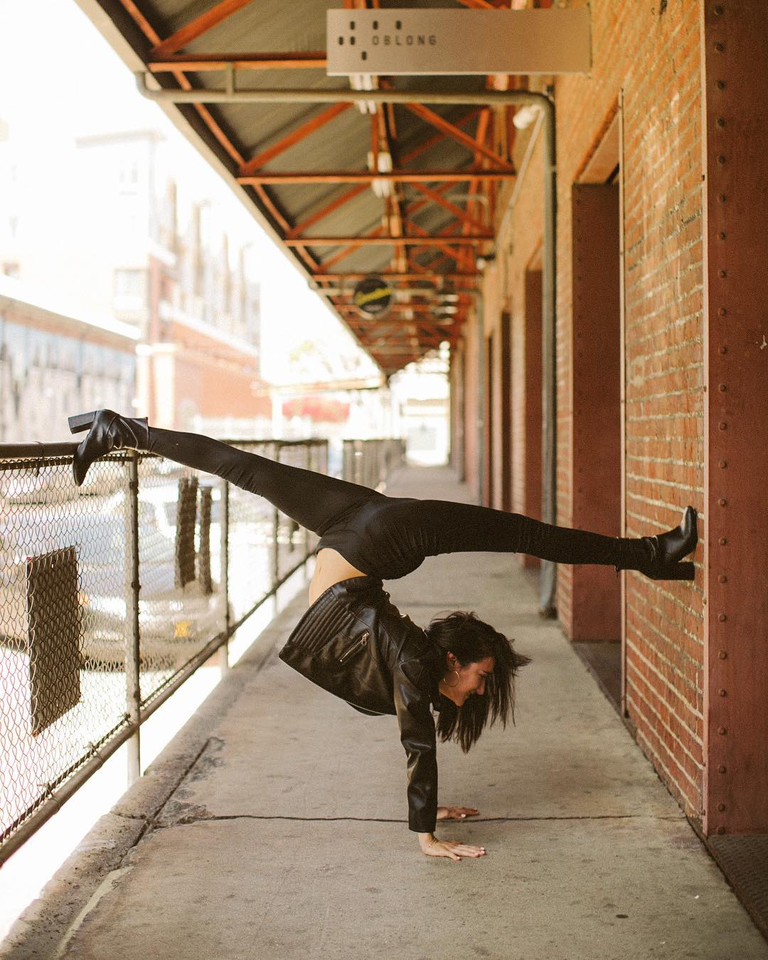Doing splits in leather jacket | Scrolller