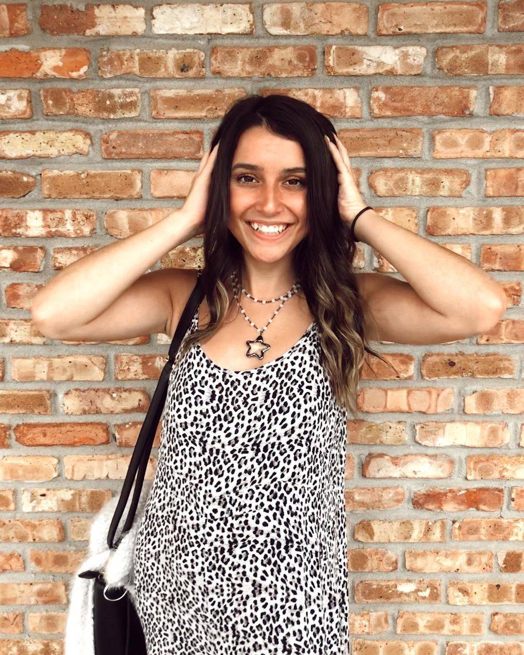 Fixing her Hair | Scrolller