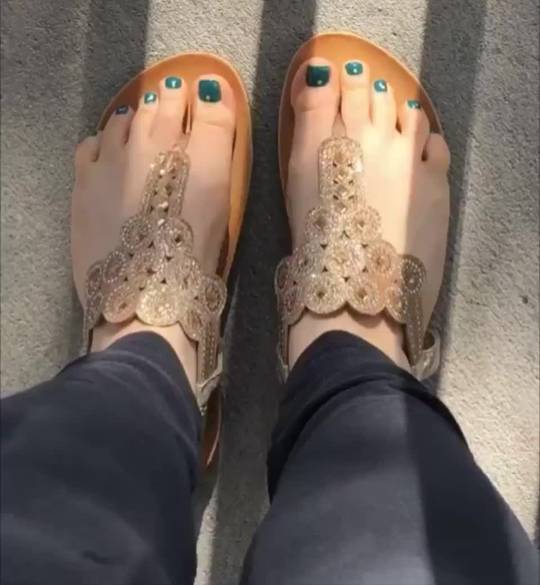 Freshly painted toes in princess sandals | Scrolller