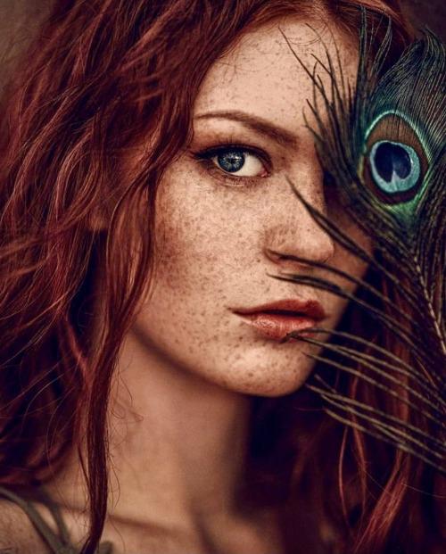 Girl with a feather | Scrolller