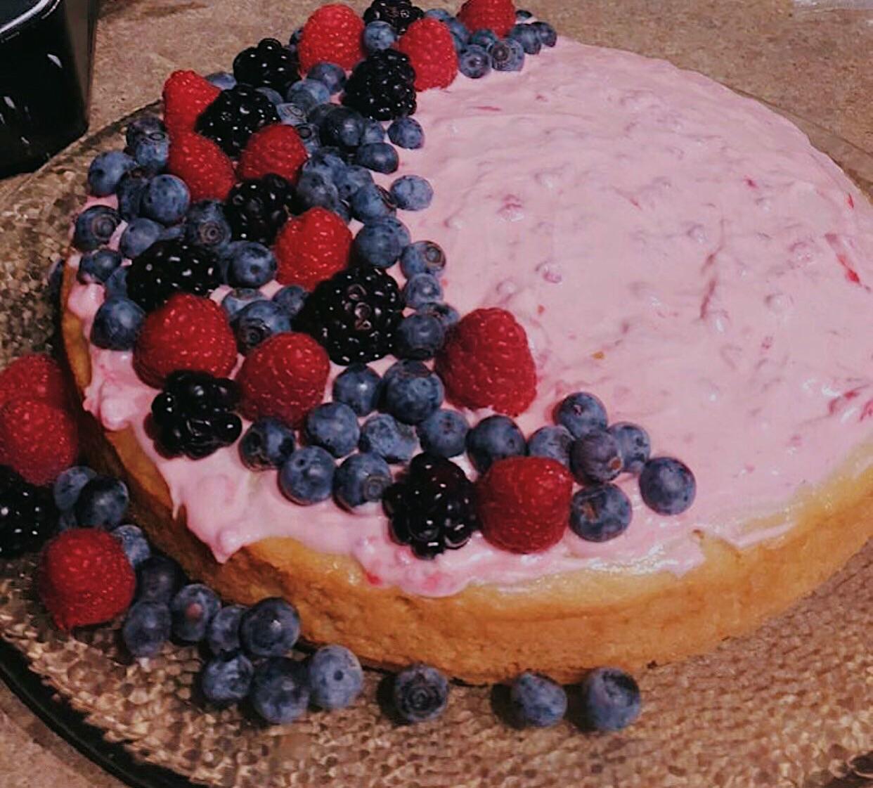 Gluten free lemon cake with raspberry frosting and berries | Scrolller