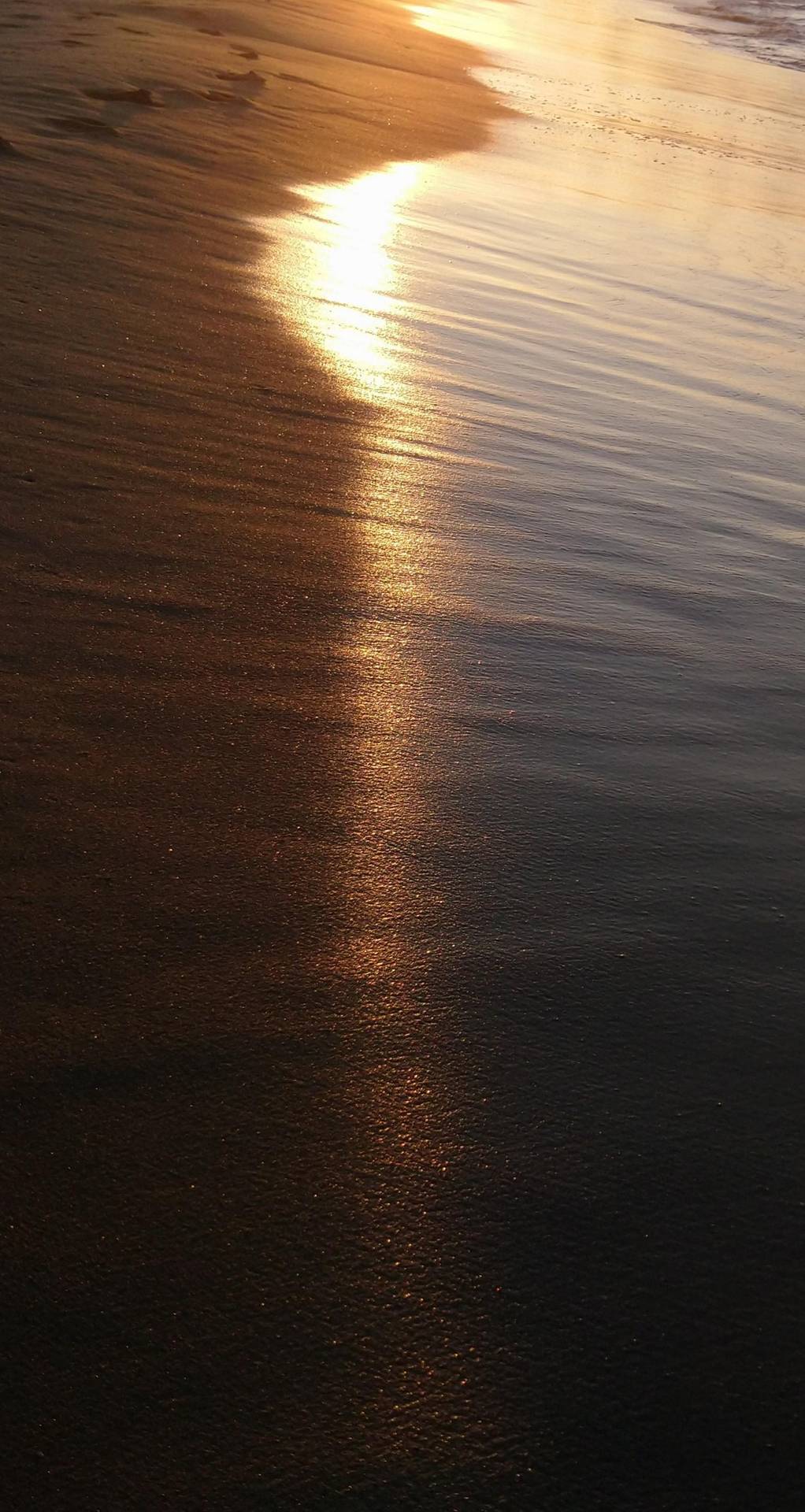 Golden sand during sunset on the beach in rethymno greece | Scrolller