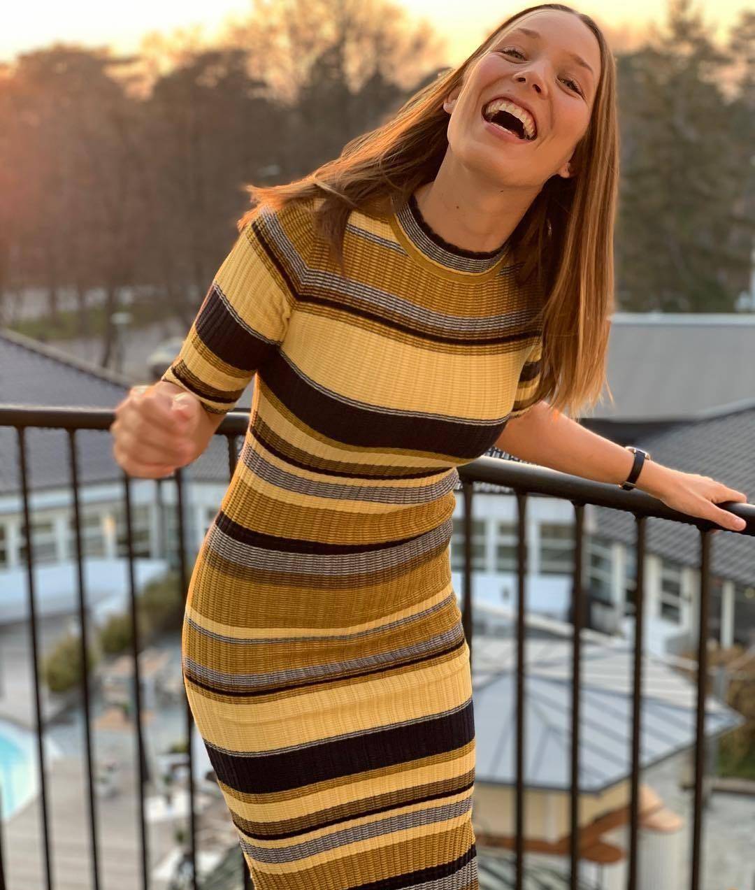 Happy girl in a tight, ribbed dress | Scrolller
