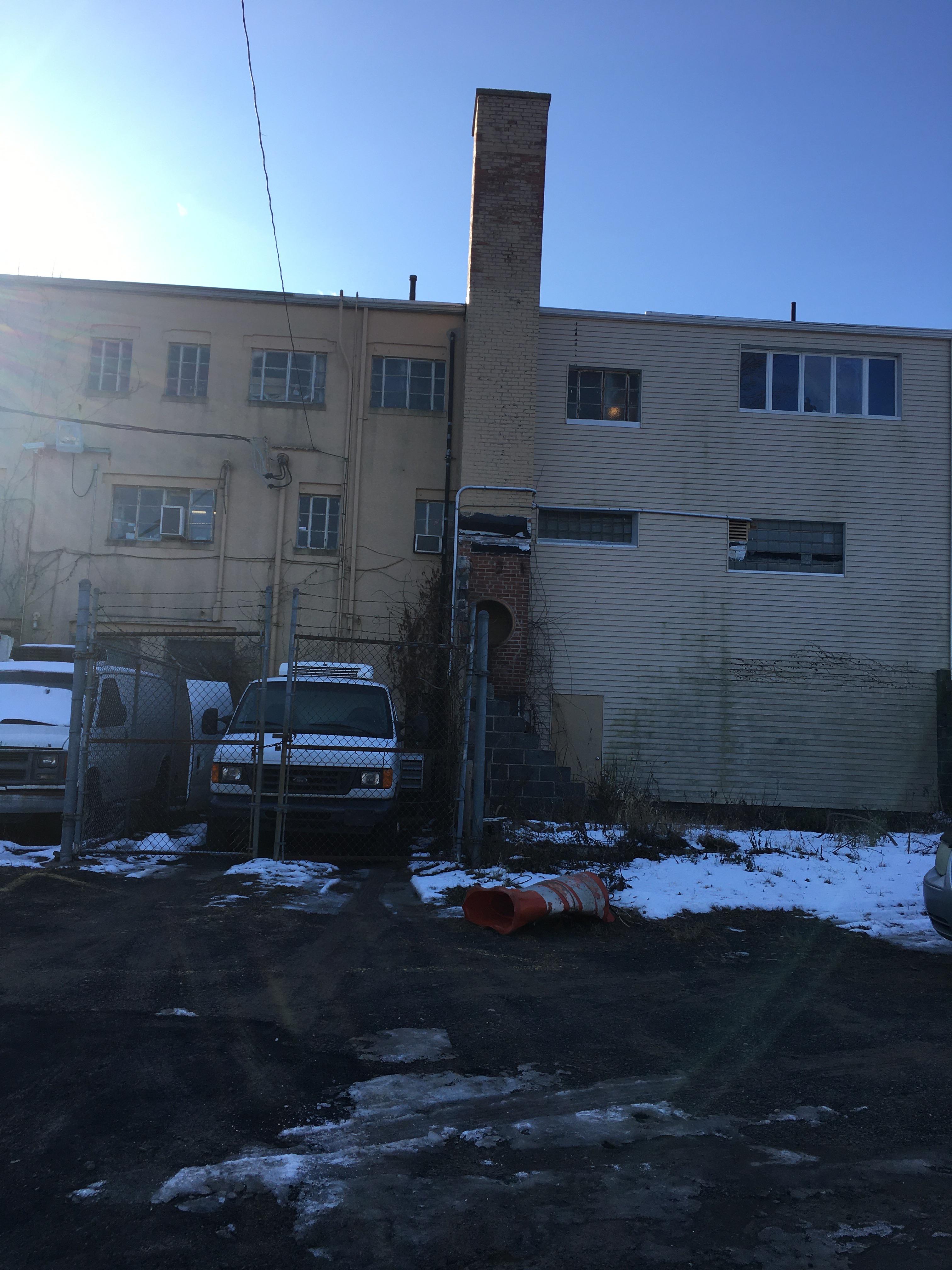 Have a monster of your choice stand near this building. | Scrolller