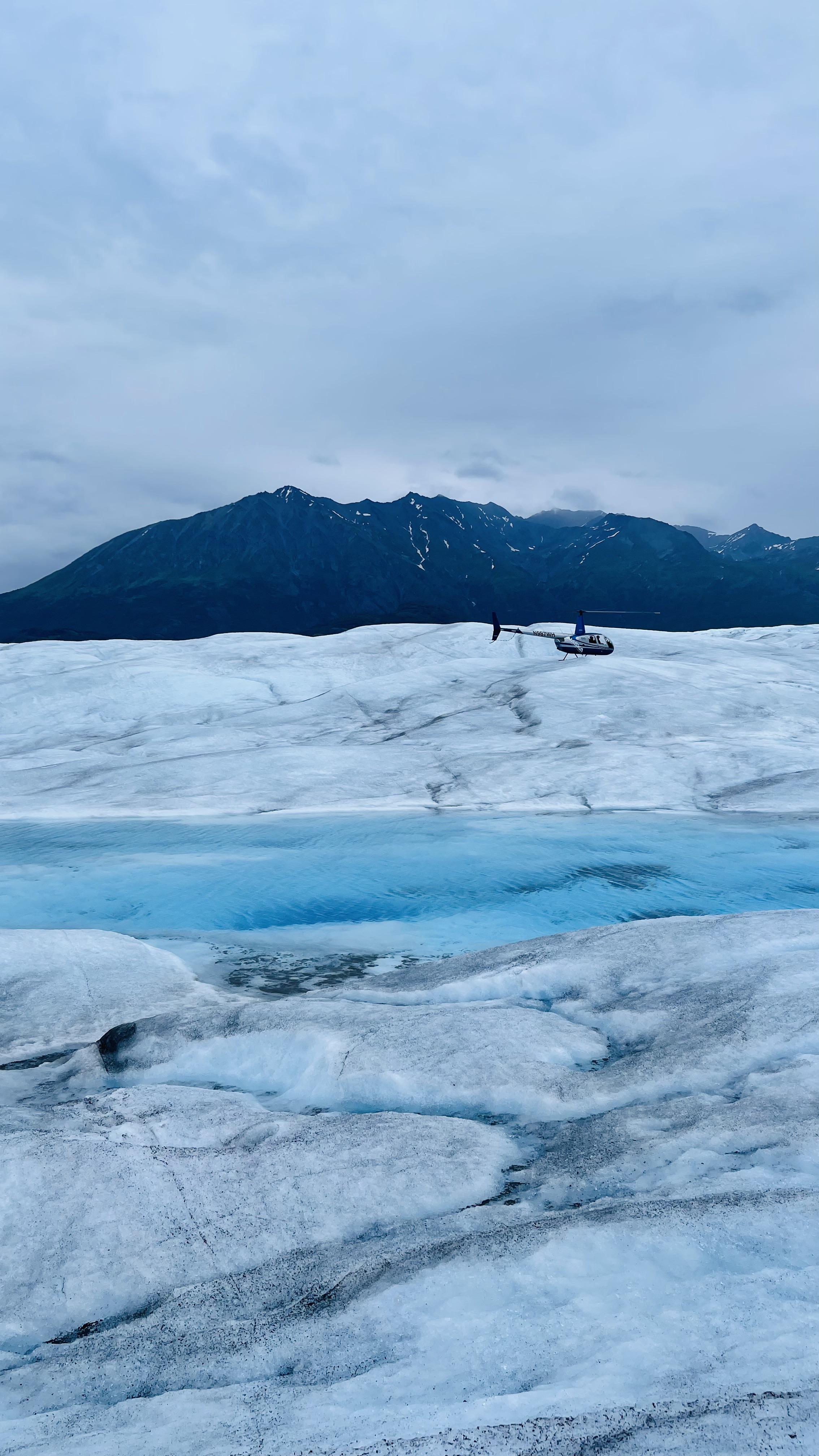 Helicopter landing on Knik Glacier, Alaska | Scrolller