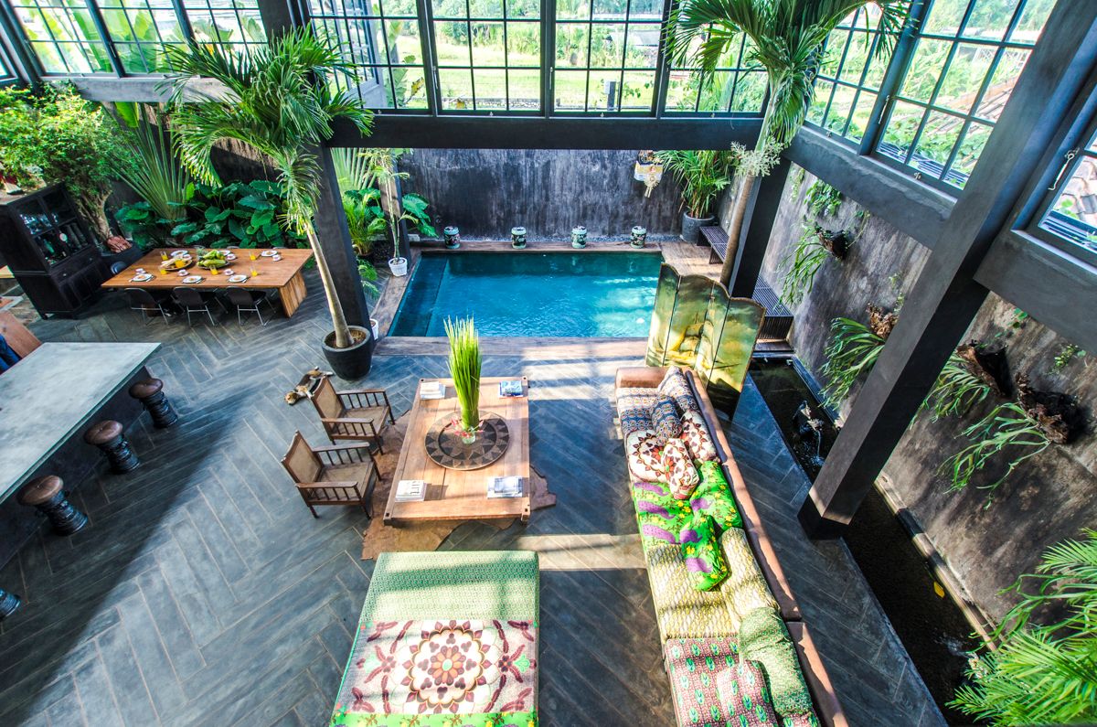 Holiday villa with an industrial open plan living space in the coastal village of Canggu, Bali ...