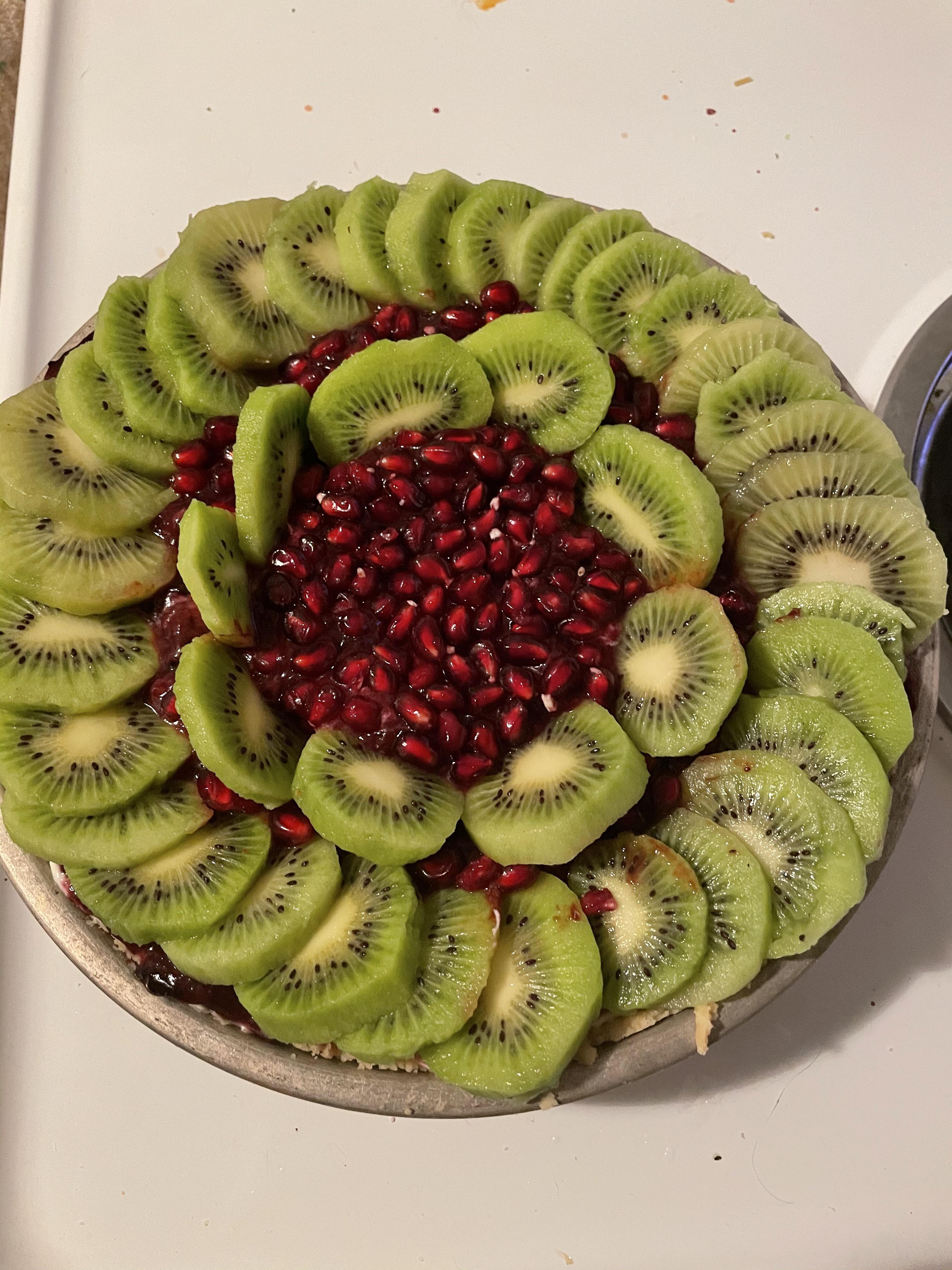 [Homemade] Fruit tart made with fresh pomegranate seeds, kiwi, and a smooth layer of plum jam in ...