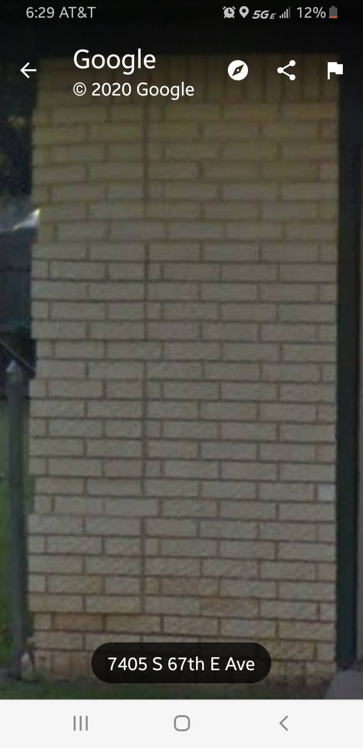 I need help identifying the style of brick this house has? It has a wave to it, like scoops have ...