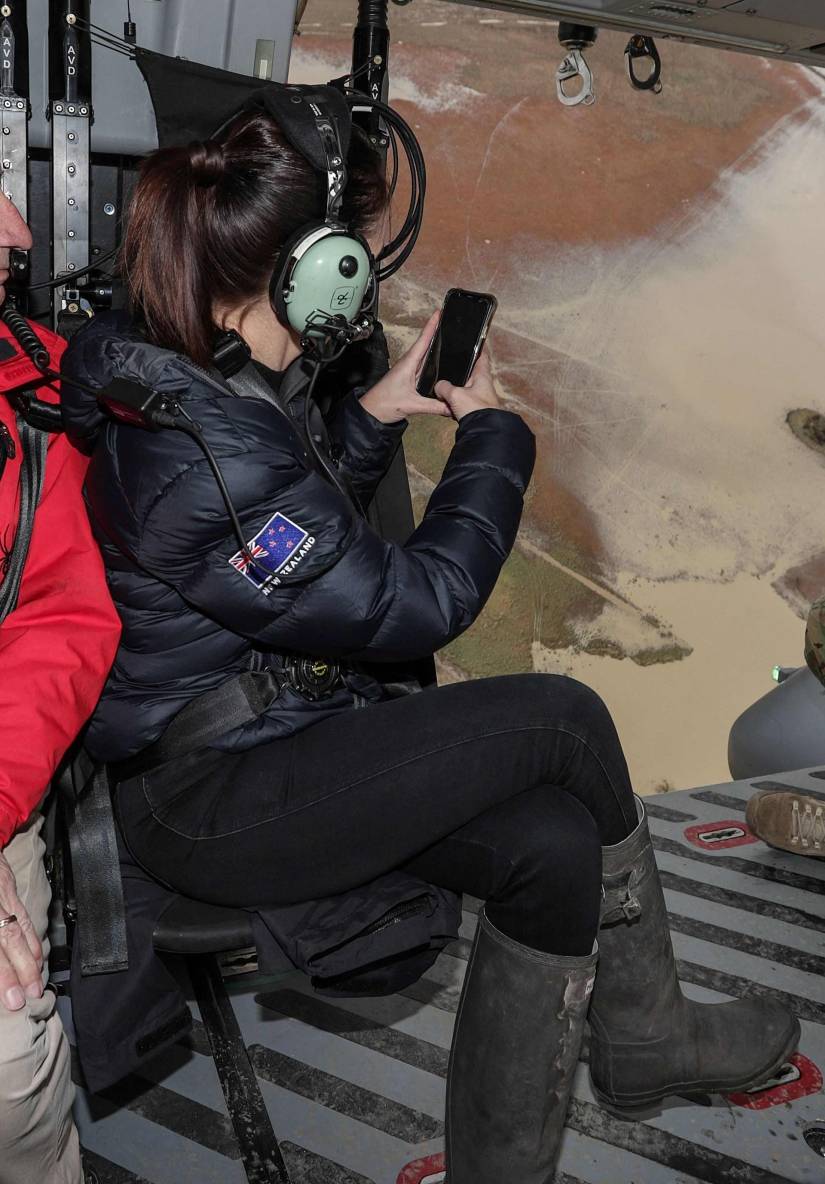 Jacinda's legs in black jeans on a helicopter | Scrolller