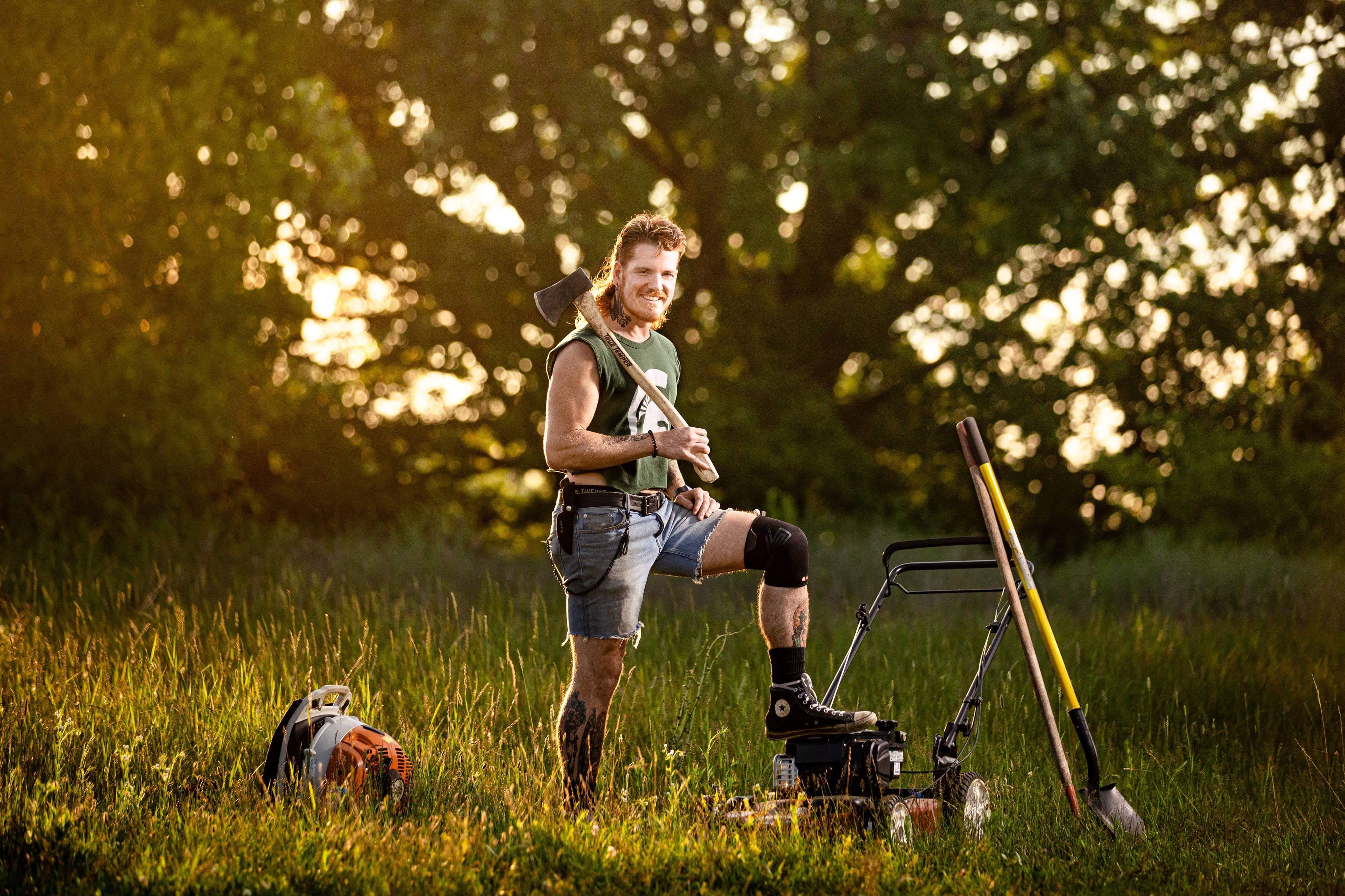 landscaper has photoshoot with his lawn equipment | Scrolller