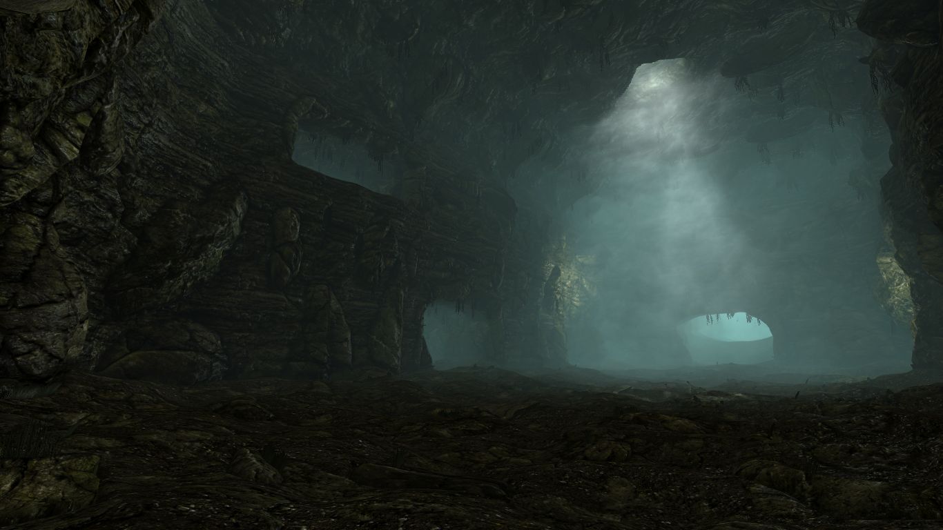 Large cavern lit by a light shaft | Scrolller