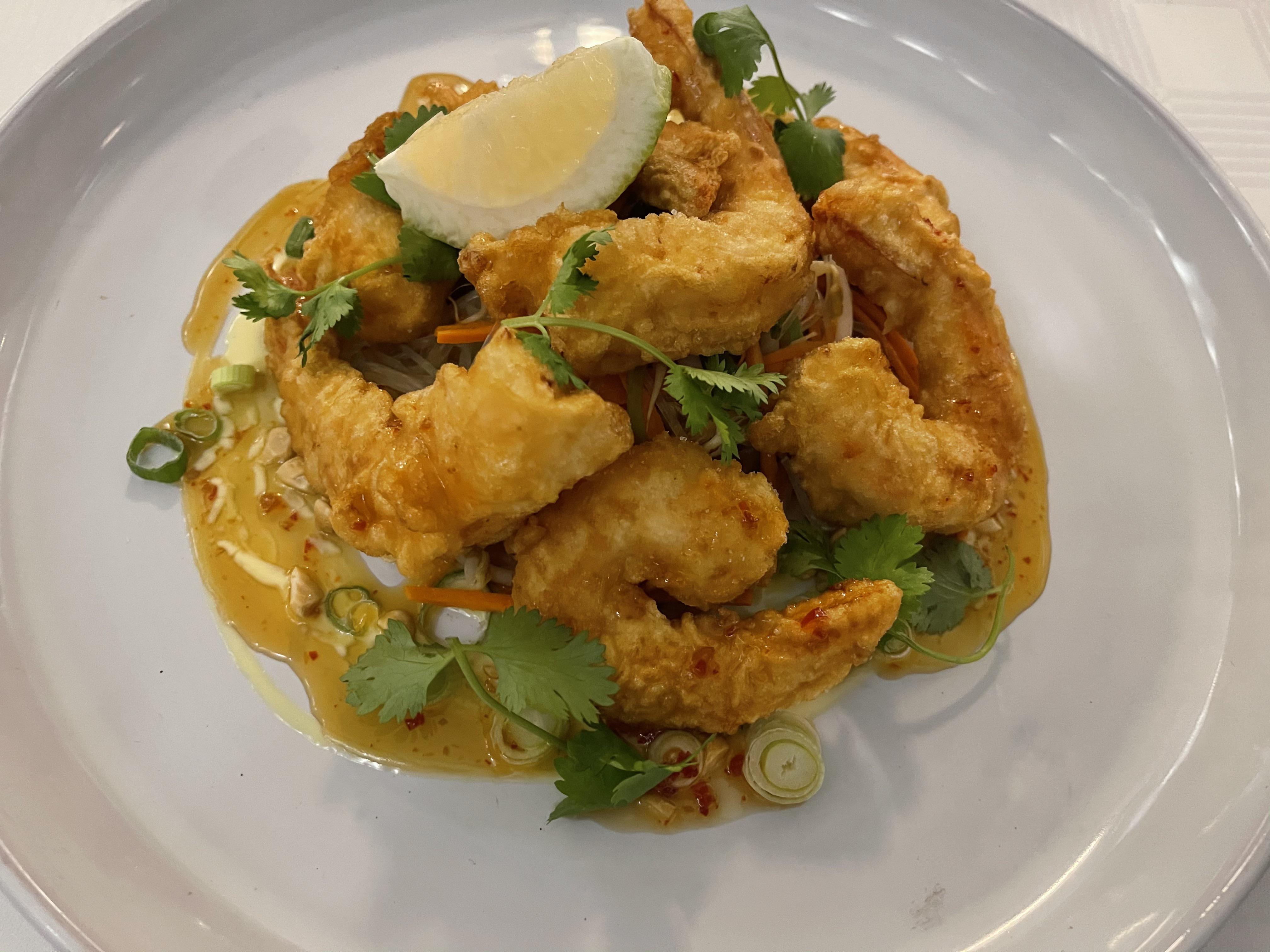 Made shrimp with sweet garlic chili sauce over noodles using tempura batter shrimp | Scrolller