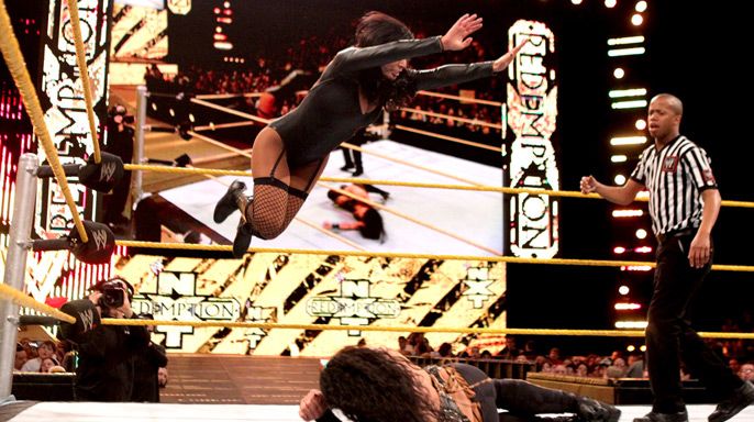 Maxine with the splash on Tamina | Scrolller