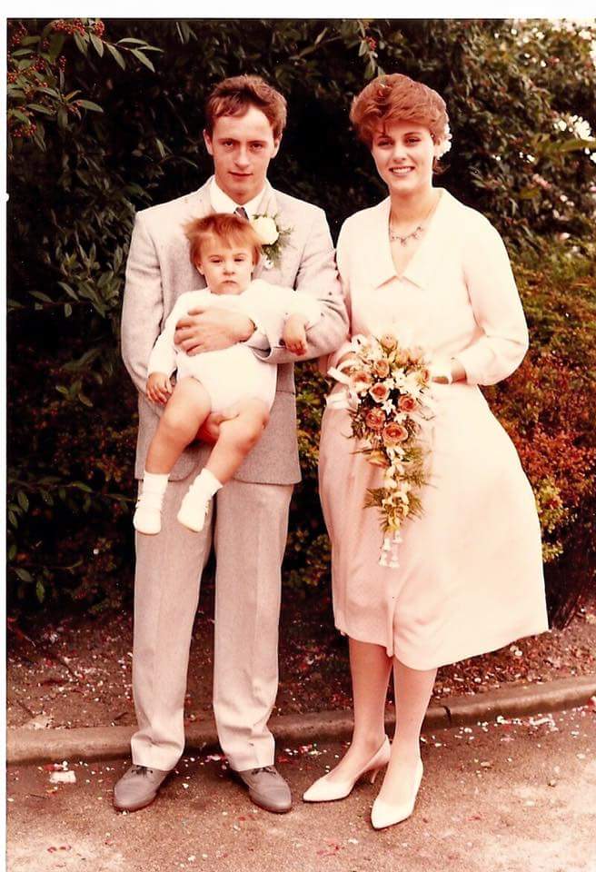 Me chubby legs and all on my parents' wedding day back in '86. Just chillin'. | Scrolller