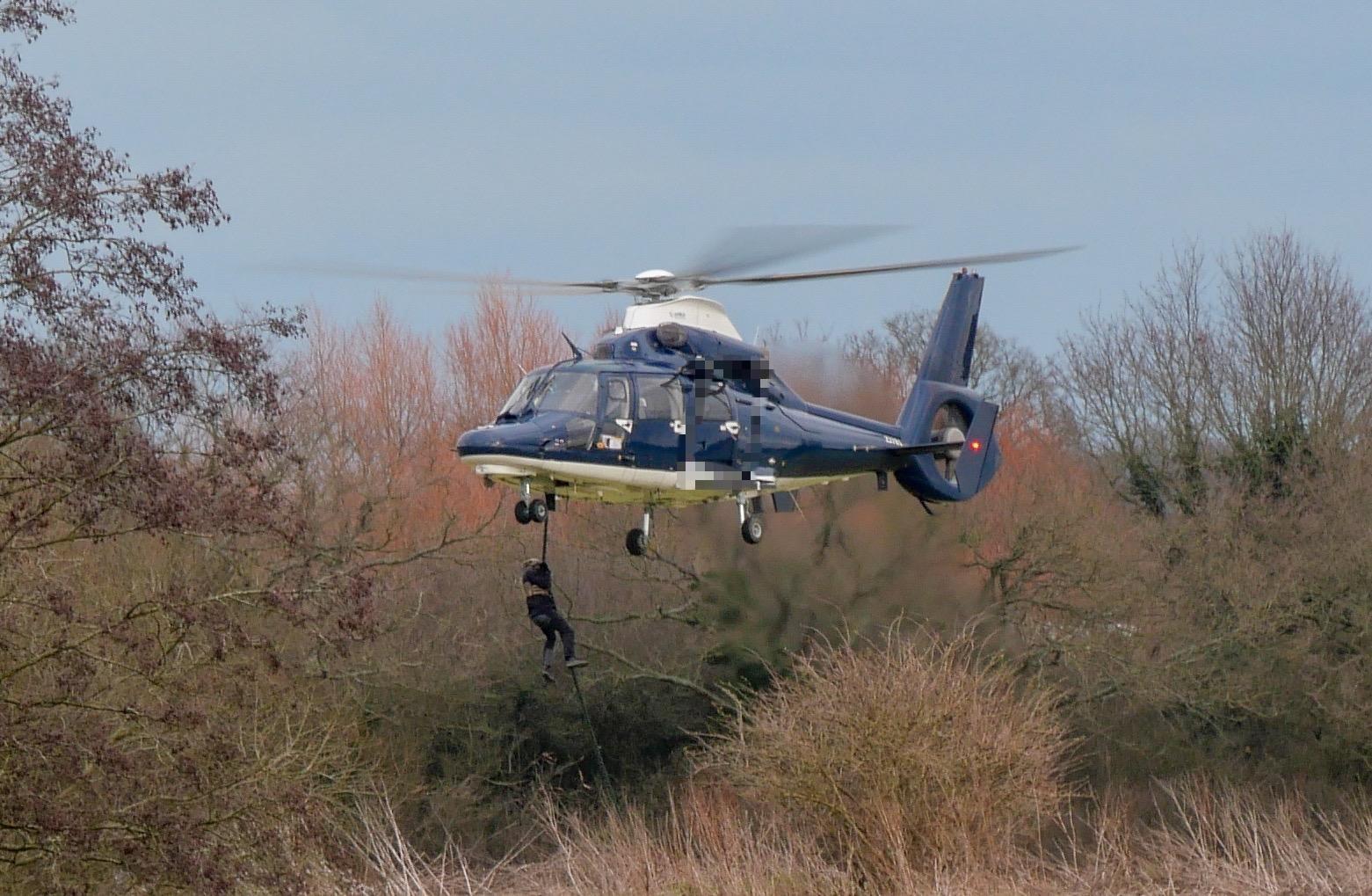 member of 22 SAS fast roping from a dauphin. | Scrolller