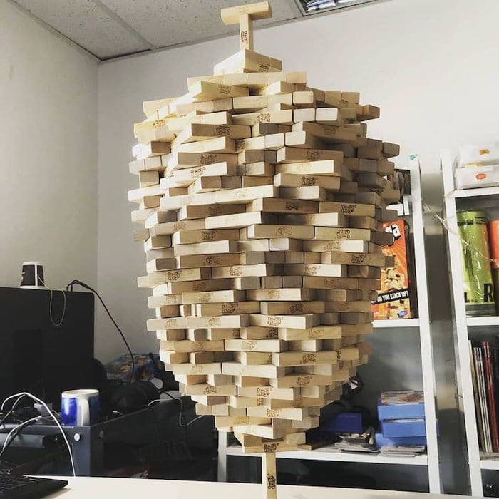 Menga_TV Breaks His Own World Record by Balancing 1,512 Jenga Pieces on a Single Block | Scrolller