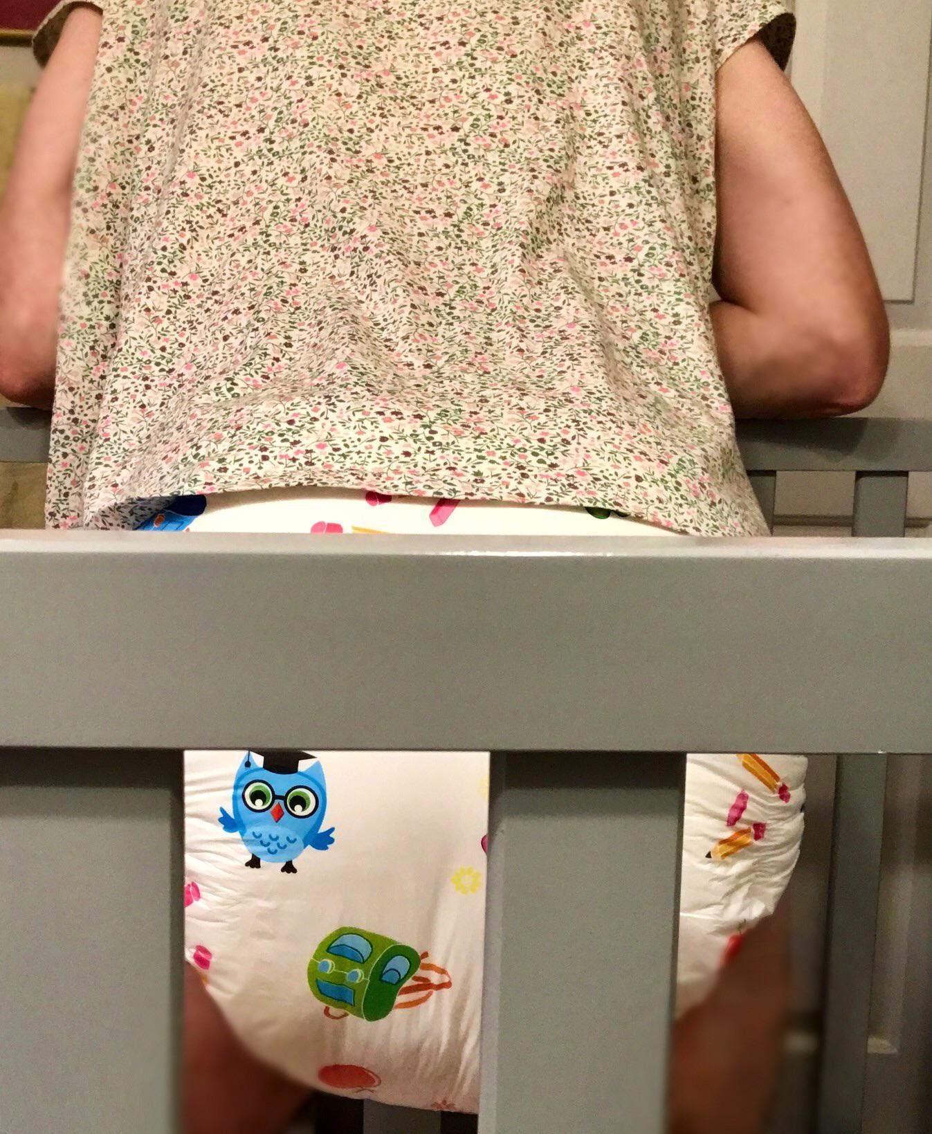 Mommy snuck a pic of me about to get out of my crib. She wanted to show how full my diaper was ...