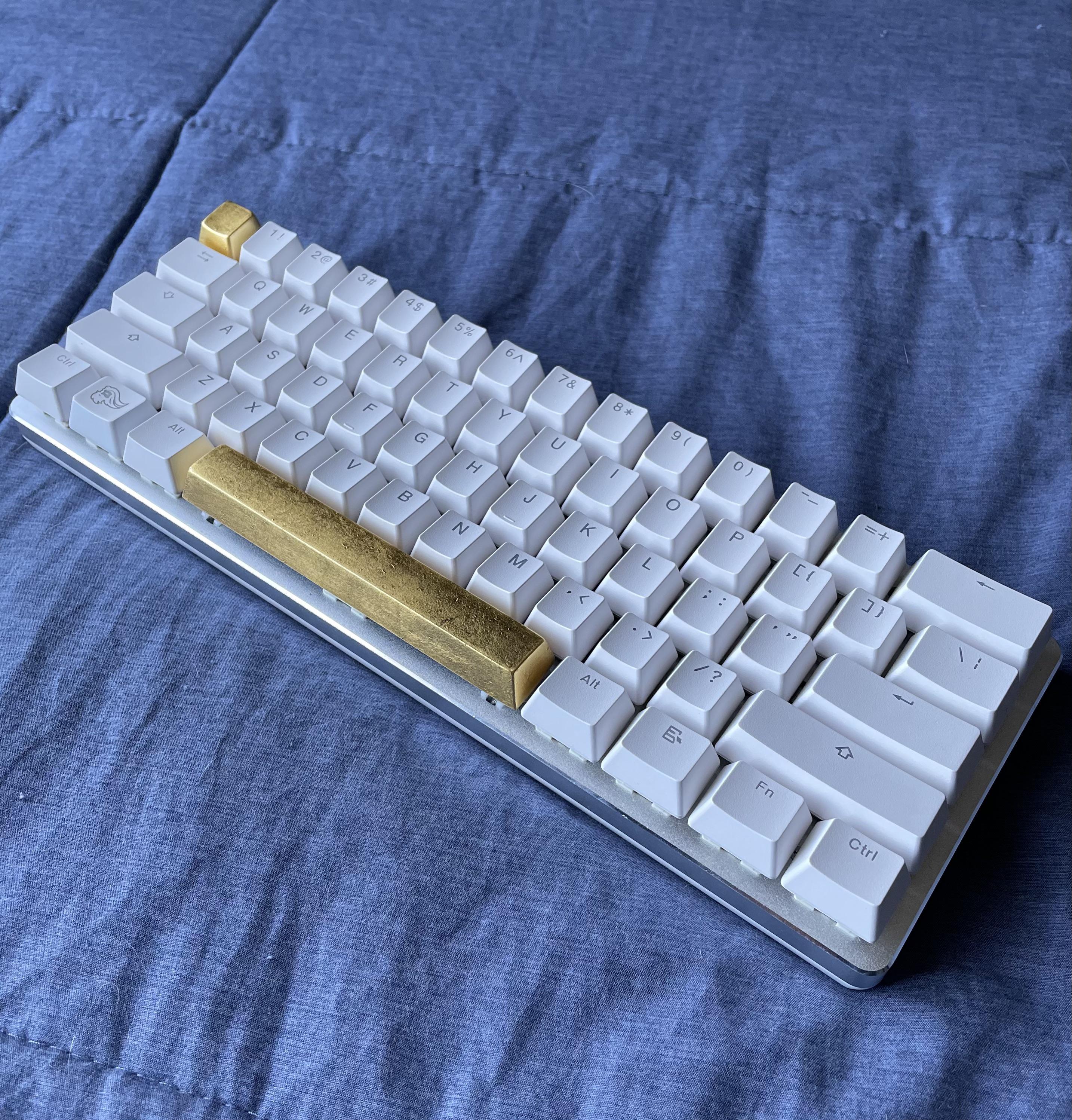 My first batch of gold leafed keycaps on my gmmk. The clearcoat seems to be holding up well so ...