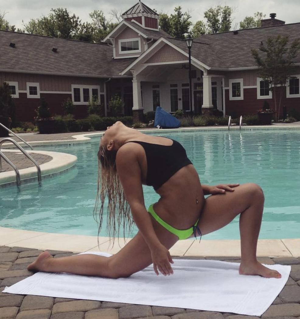 NASCAR driver Natalie Decker with a belly ring in a bikini | Scrolller