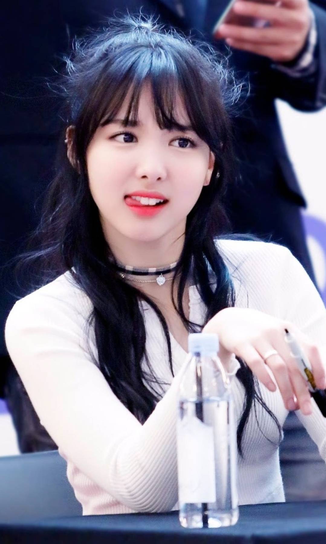 Nayeon - white sweater, tougue stuck out | Scrolller