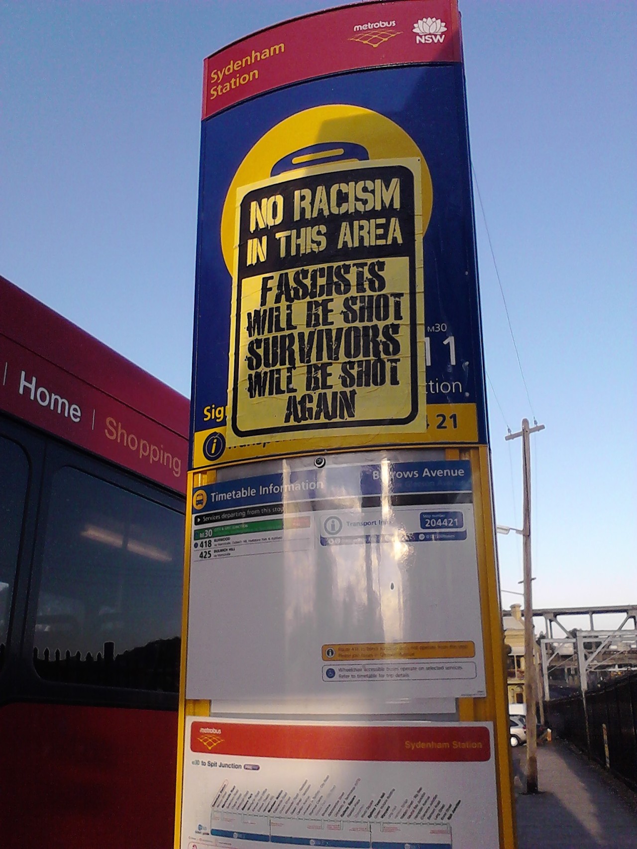 "No racism in this area. Fascists will be shot, survivors will be shot again" poster in Sydney ...