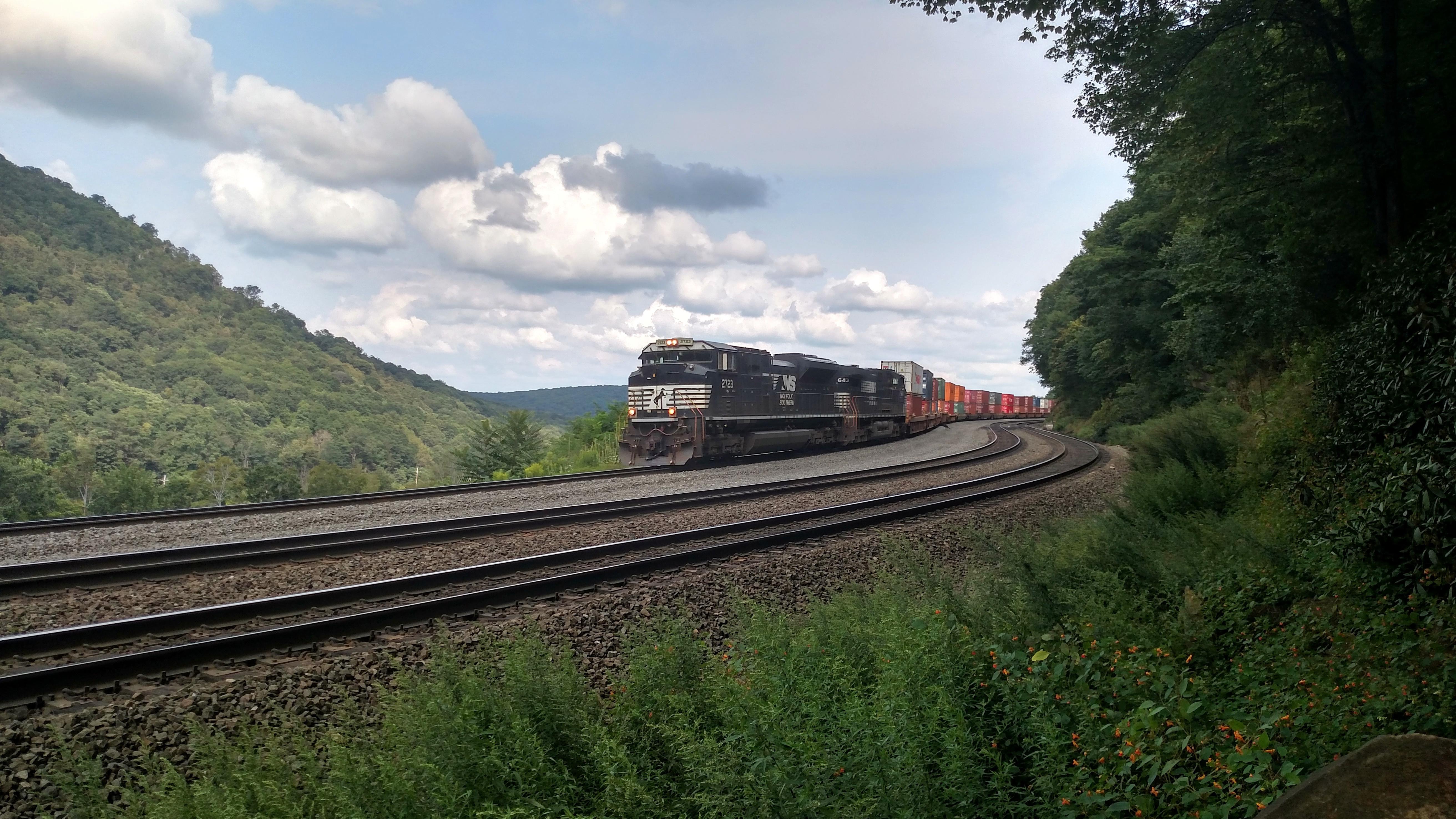 Norfolk Southern SD70M-2 leads a container train around Horseshoe Curve ...