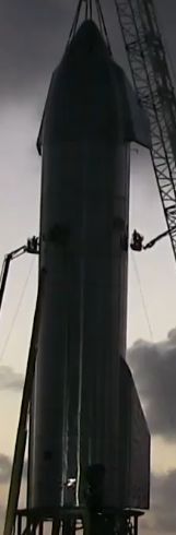 Nosecone attached [humans for scale] | Scrolller