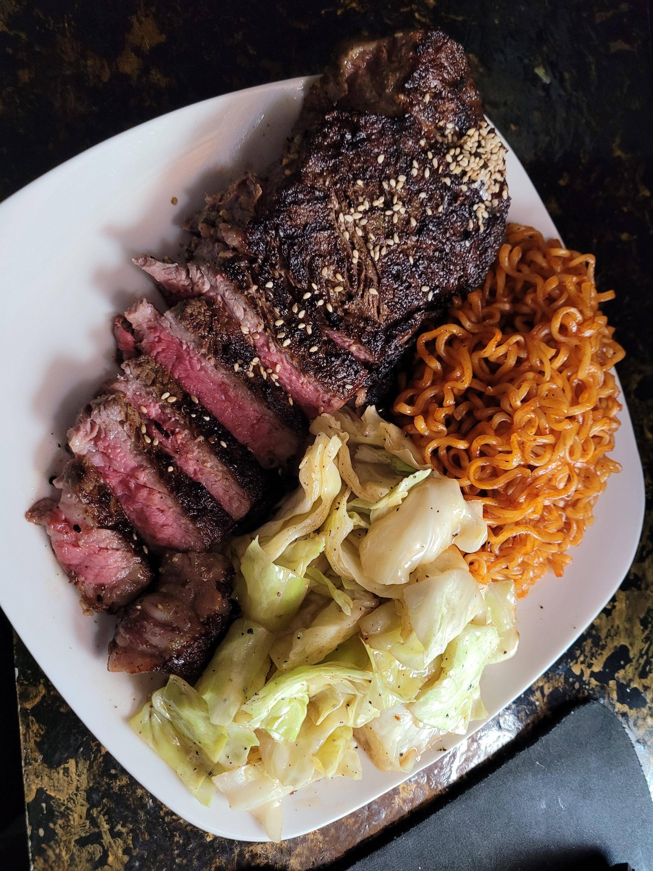 NY strip with spicy noodles and cabbage | Scrolller