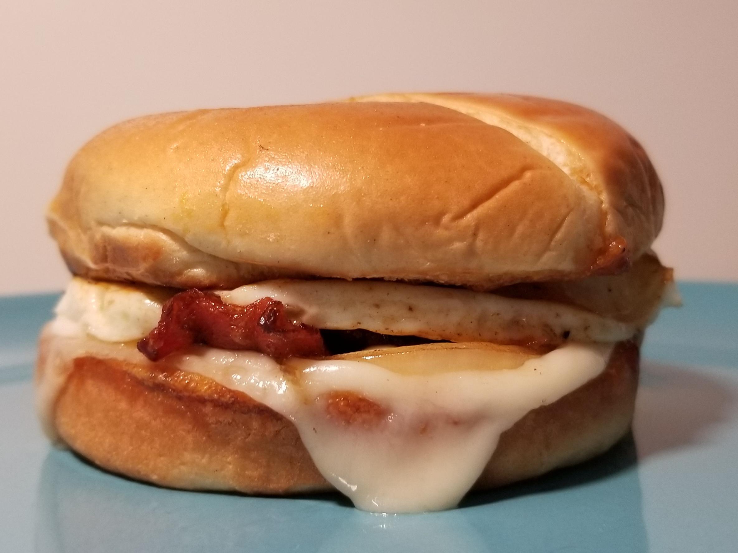 [OC] Maple bacon & egg breakfast sandwich with swiss cheese, caramalized onions and chipotle ...