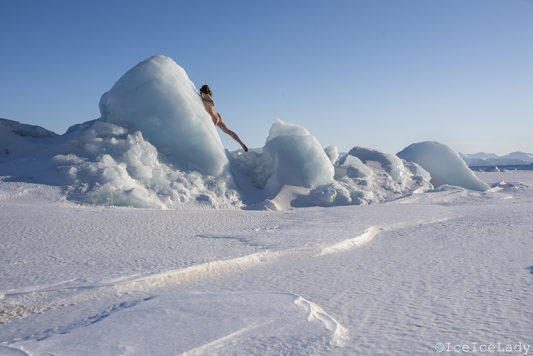 On glacier ice frozen in the sea ice. | Scrolller
