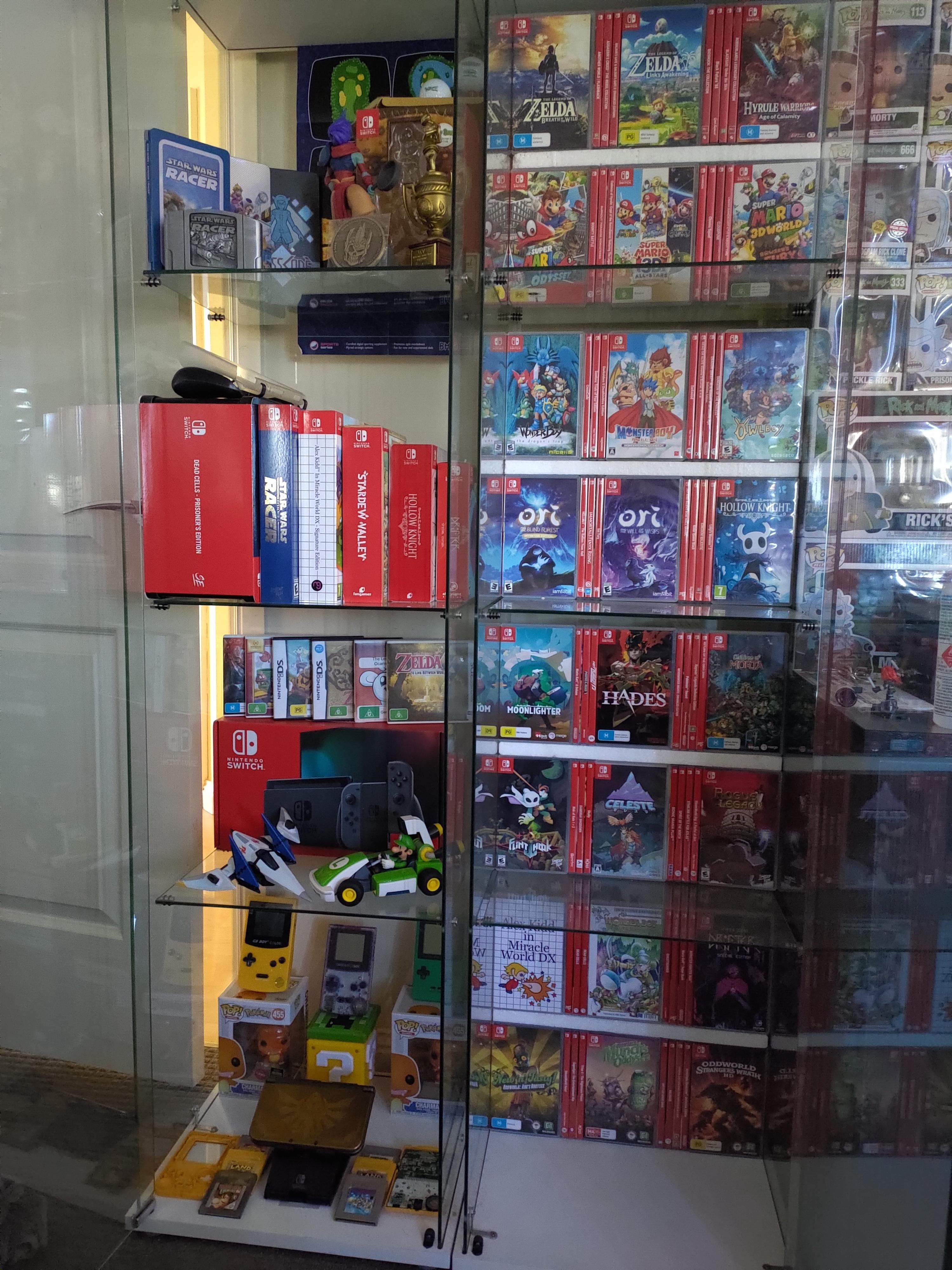 One display cabinet finally filled top to bottom only switch games. There is something about the ...