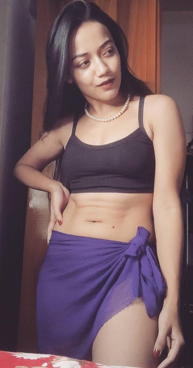 Pallavi Basu navel in black top and purple skirt | Scrolller