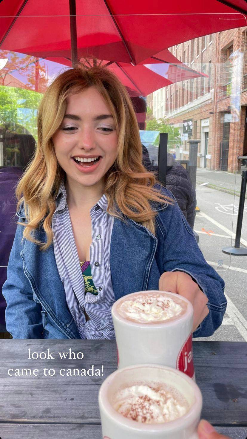 Peyton List enjoying a beverage | Scrolller