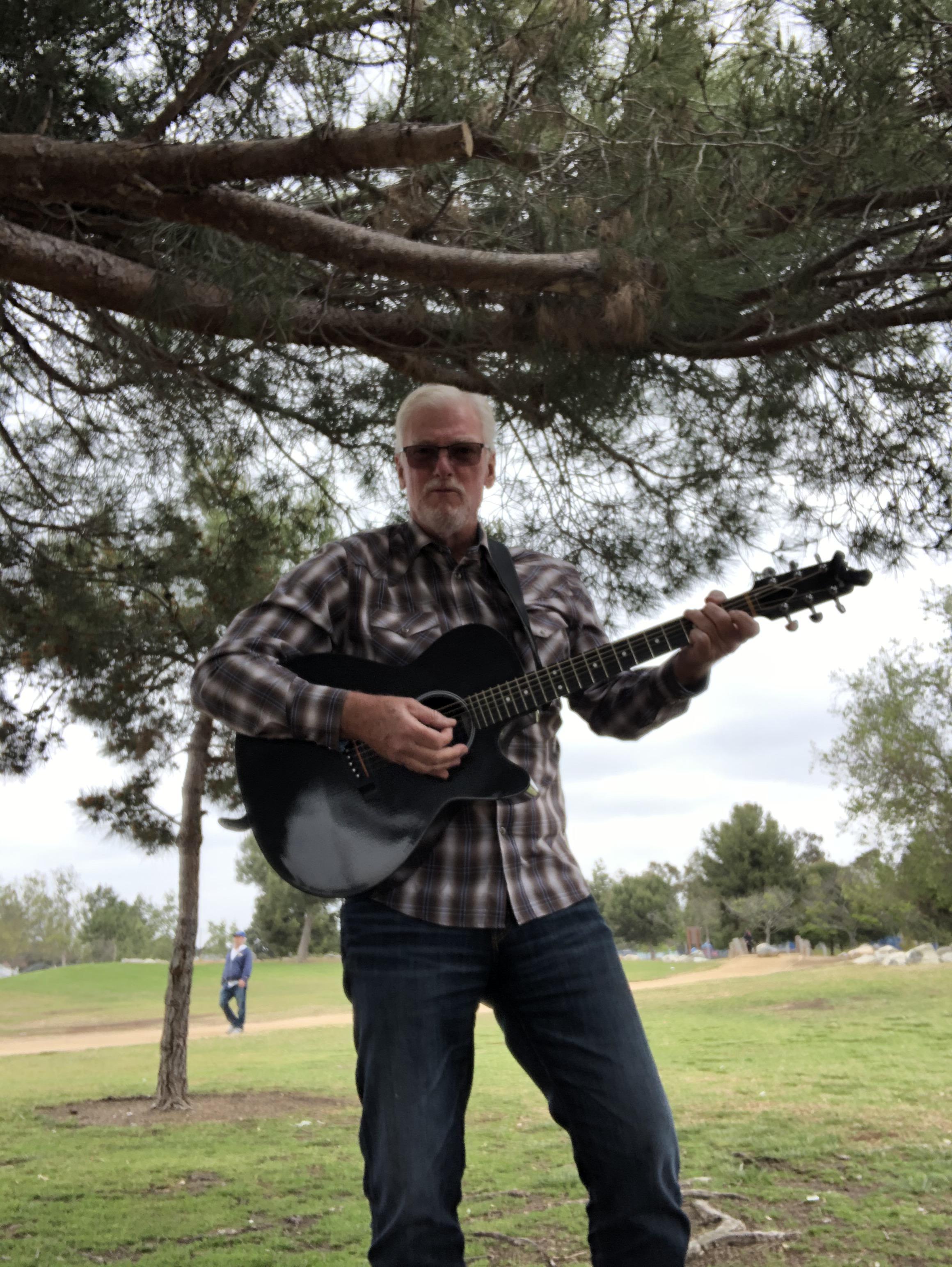 Playing Guitar in the Park {M} 61 | Scrolller