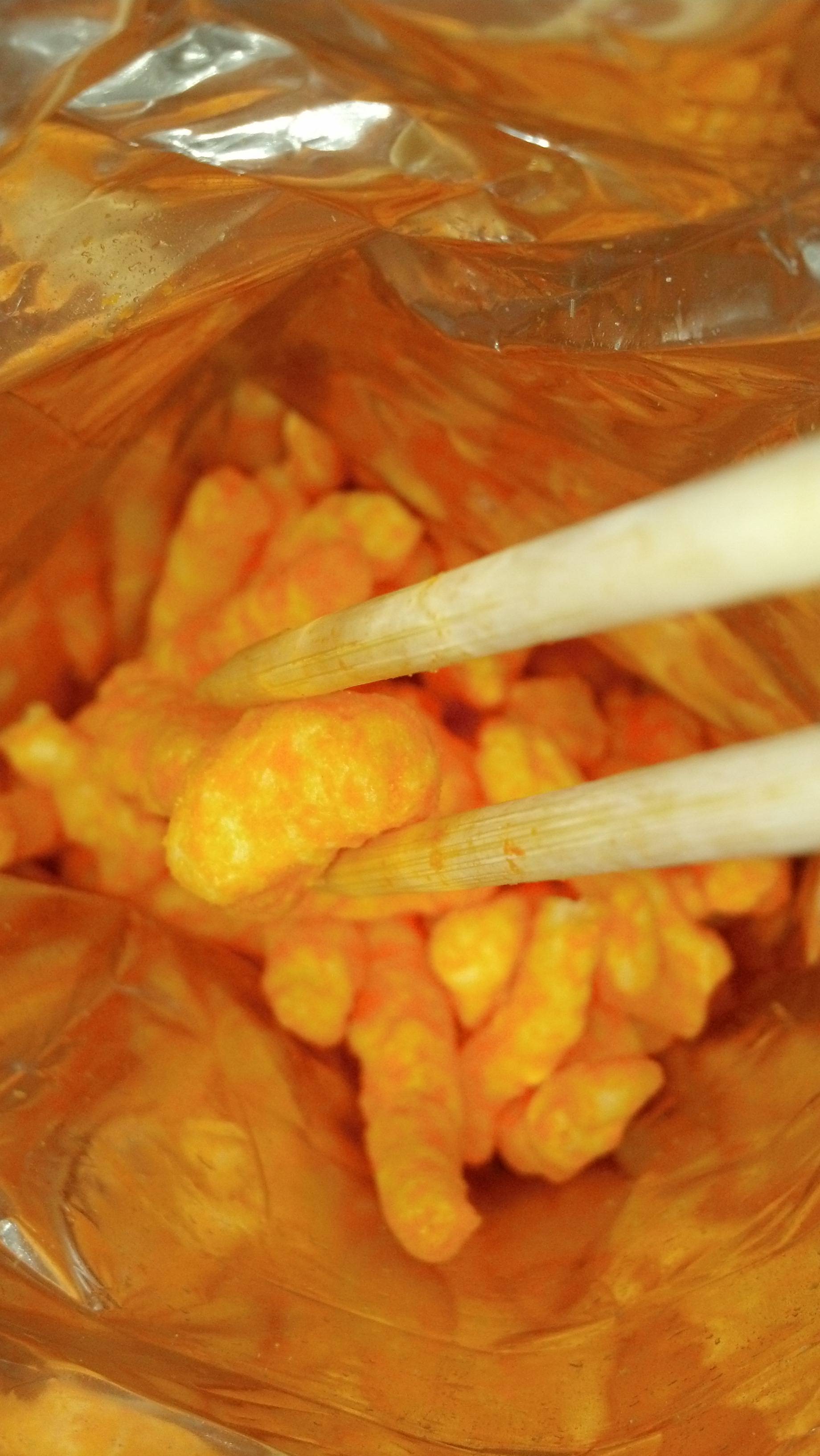 Protip: use chopsticks to keep the orange crap off your fingers | Scrolller