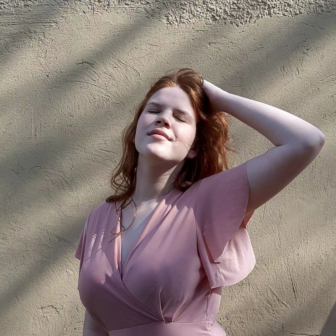 Redhead enjoying sunlight | Scrolller