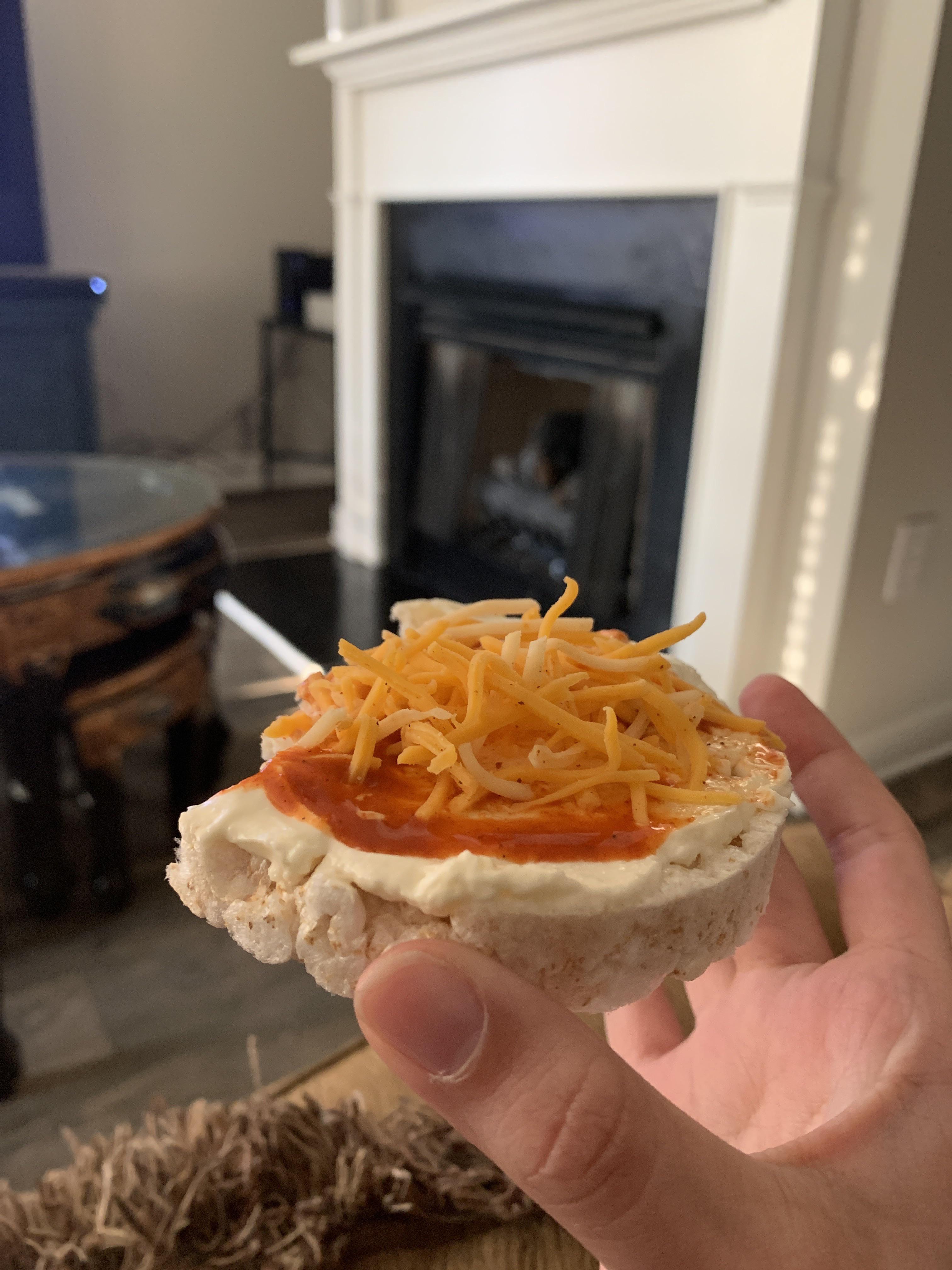 rice cake with mayo, tapatío hot sauce, shredded cheese | Scrolller