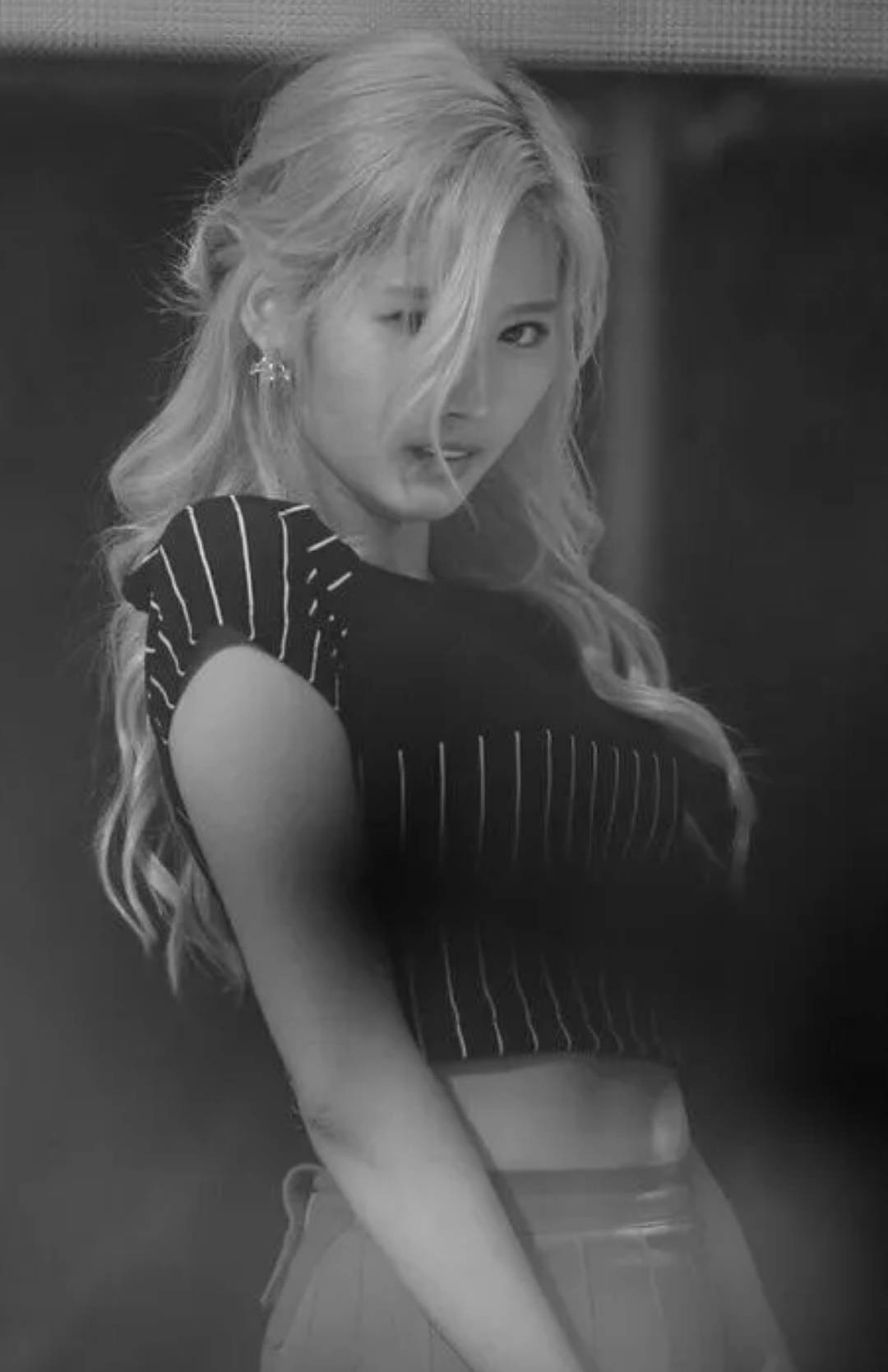 Sana - b&w photo, blonde, black top | Scrolller