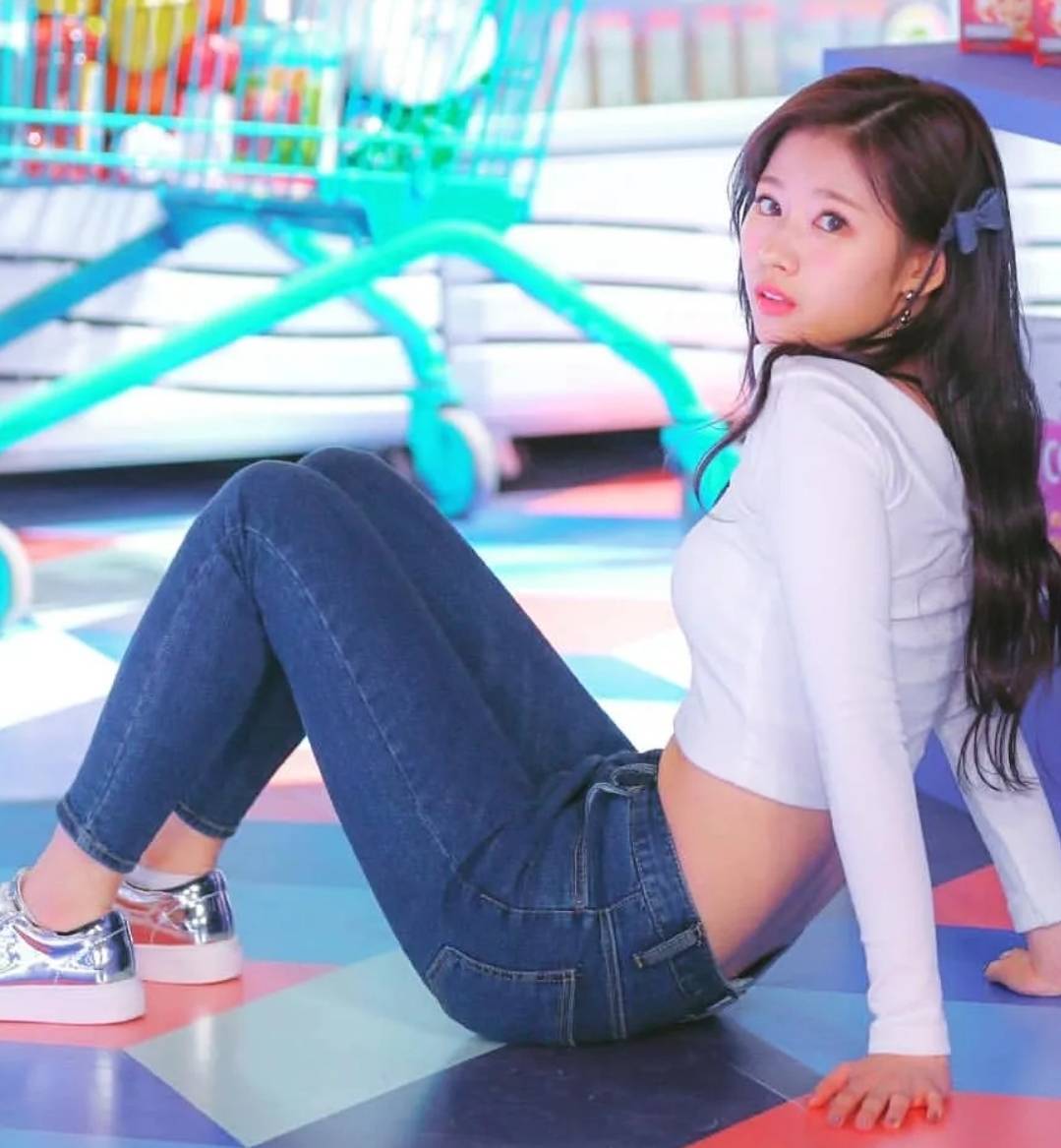 Sana - jeans, white top, heartshaker outfit | Scrolller