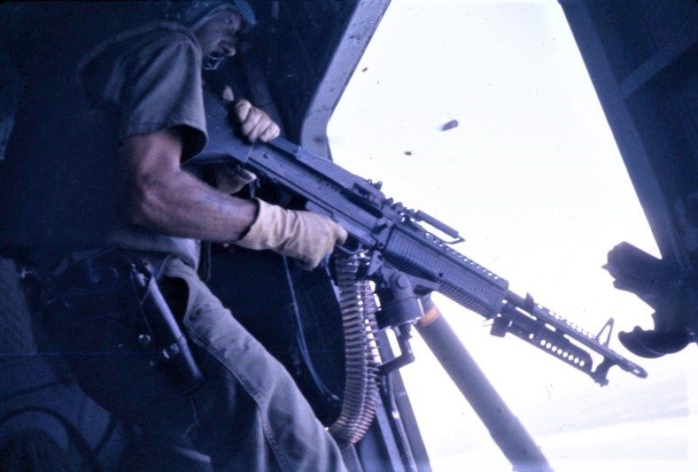 September 1965. Helicopter door gunner in action with his machine gun. Photo and caption via Col ...