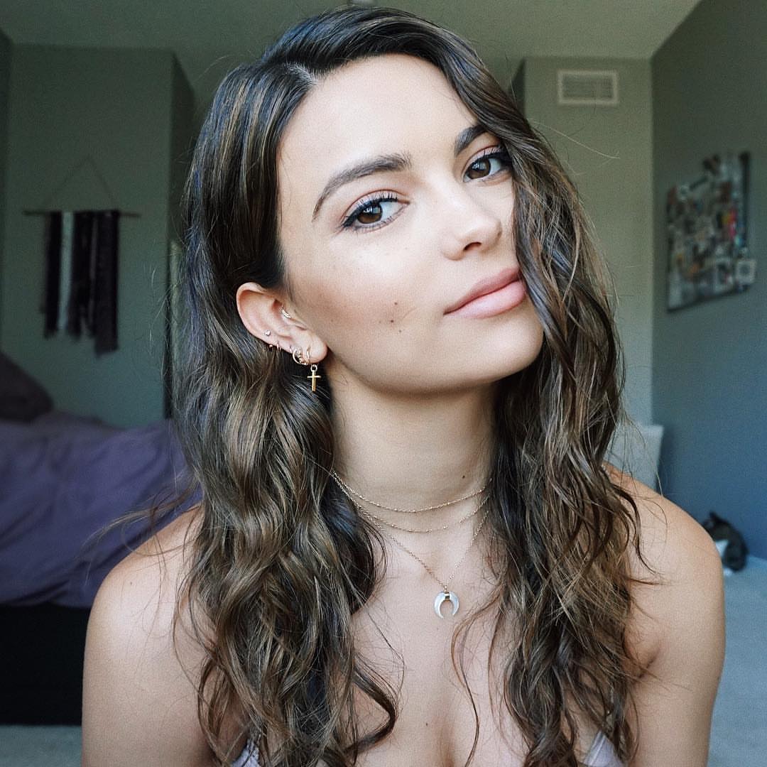 Showing off her new earrings | Scrolller