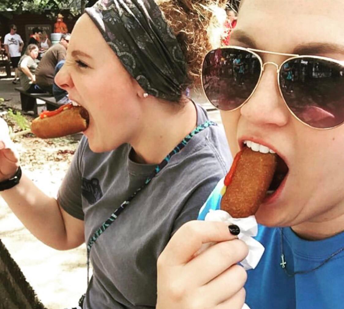 Sisters having fun at the fair | Scrolller