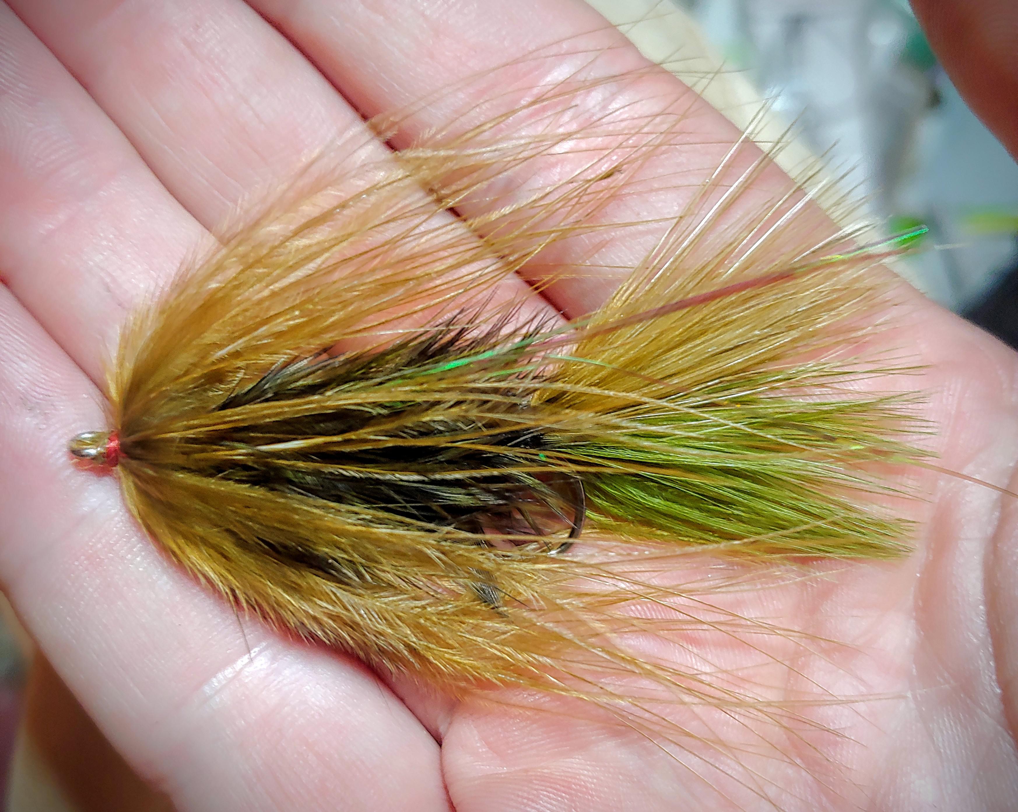 Small articulated streamer with hidden tungsten cone head behind the Maribou collar. | Scrolller