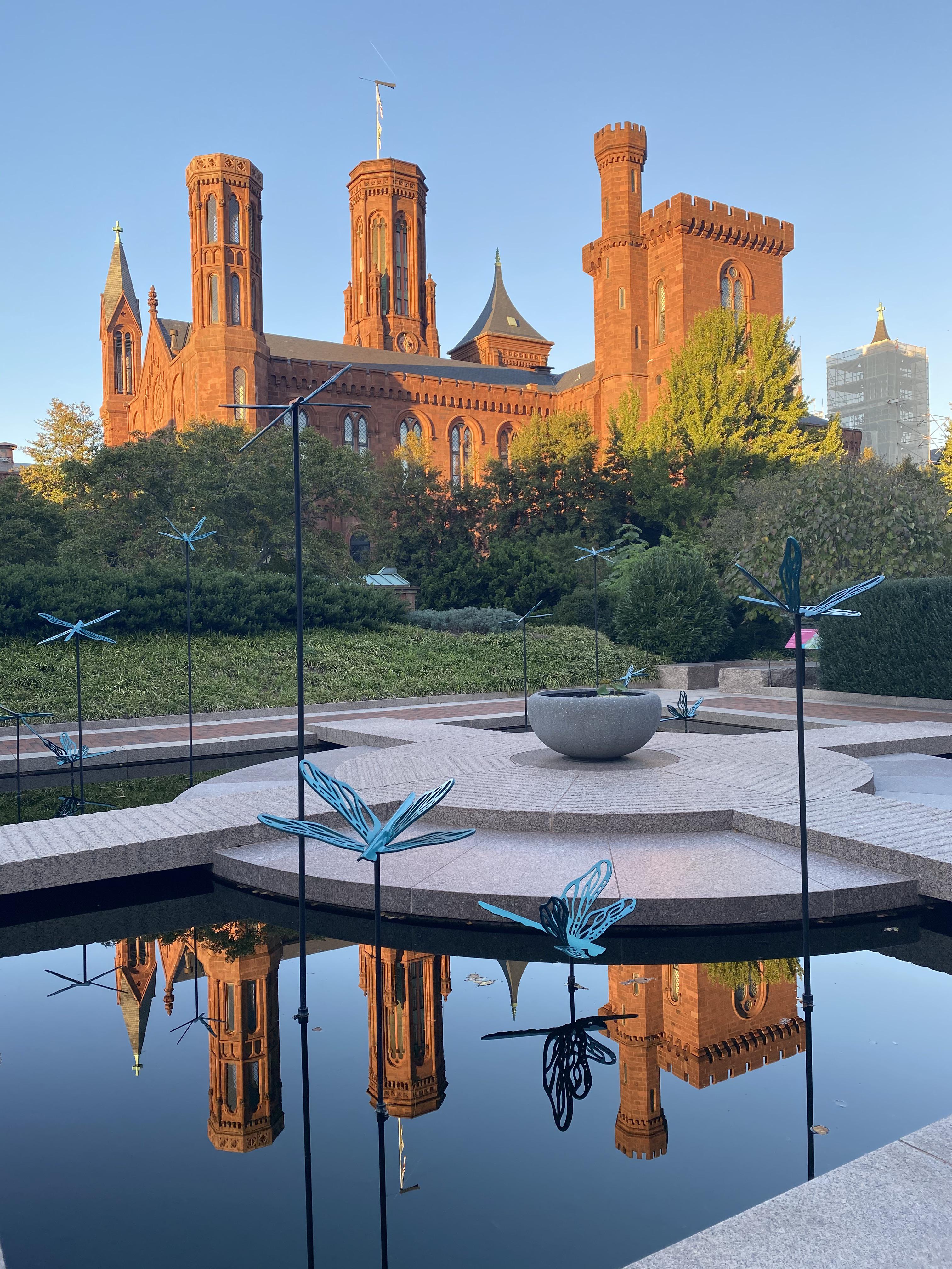 Smithsonian Castle reflecting in Moongate Garden | Scrolller