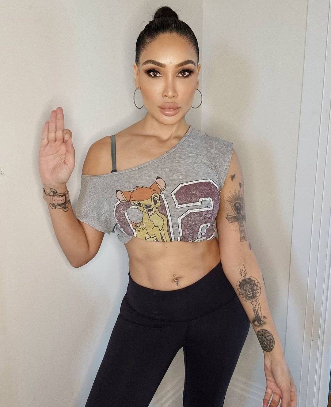Sofia Hayat navel in grey off-shoulder top and black pants | Scrolller