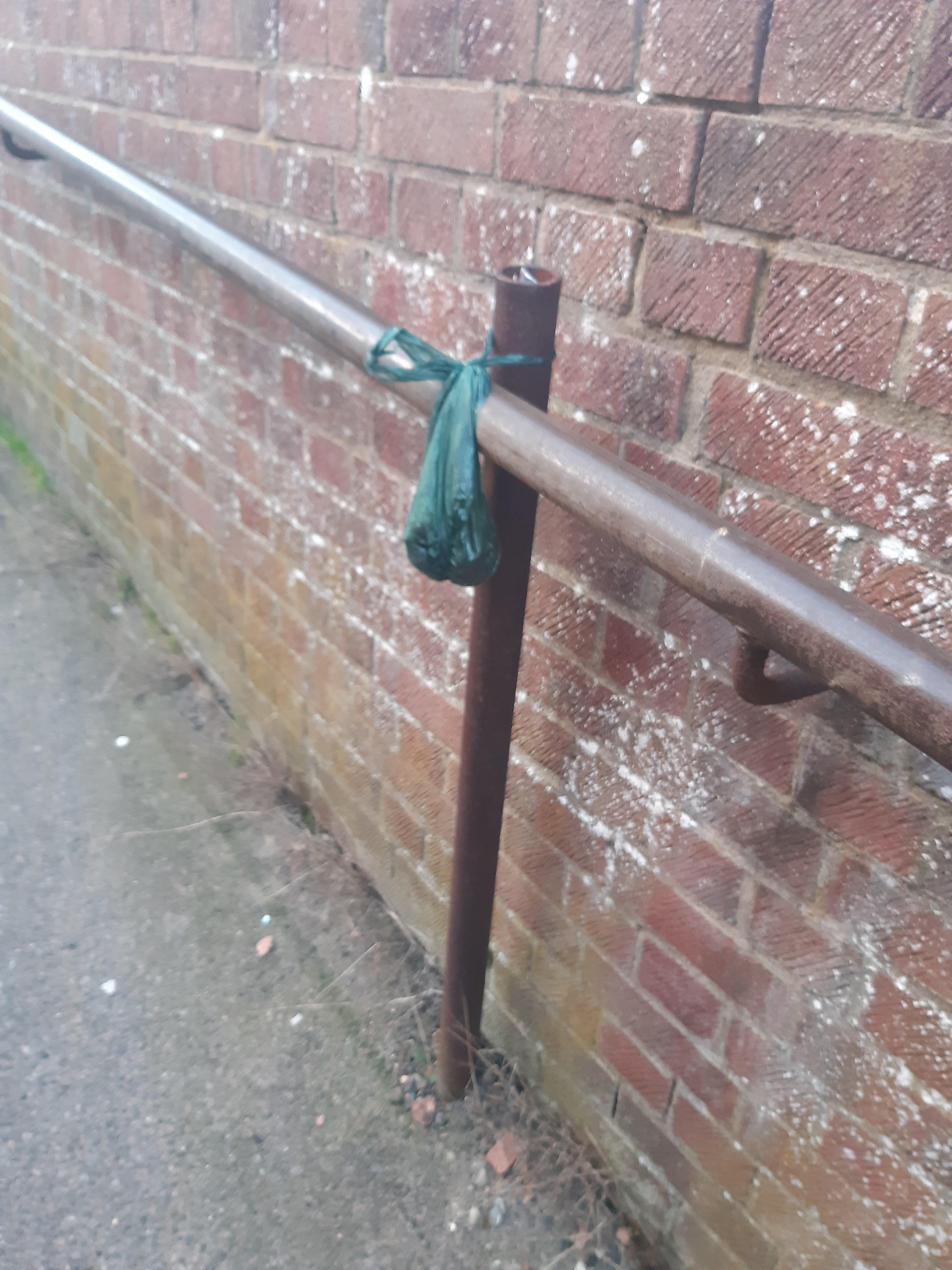 Some dirty person tied their rubbish to a handrail, theres a bin literally 20 feet away | Scrolller
