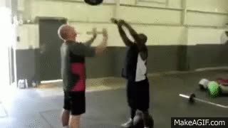 Squat to overhead throw | Scrolller