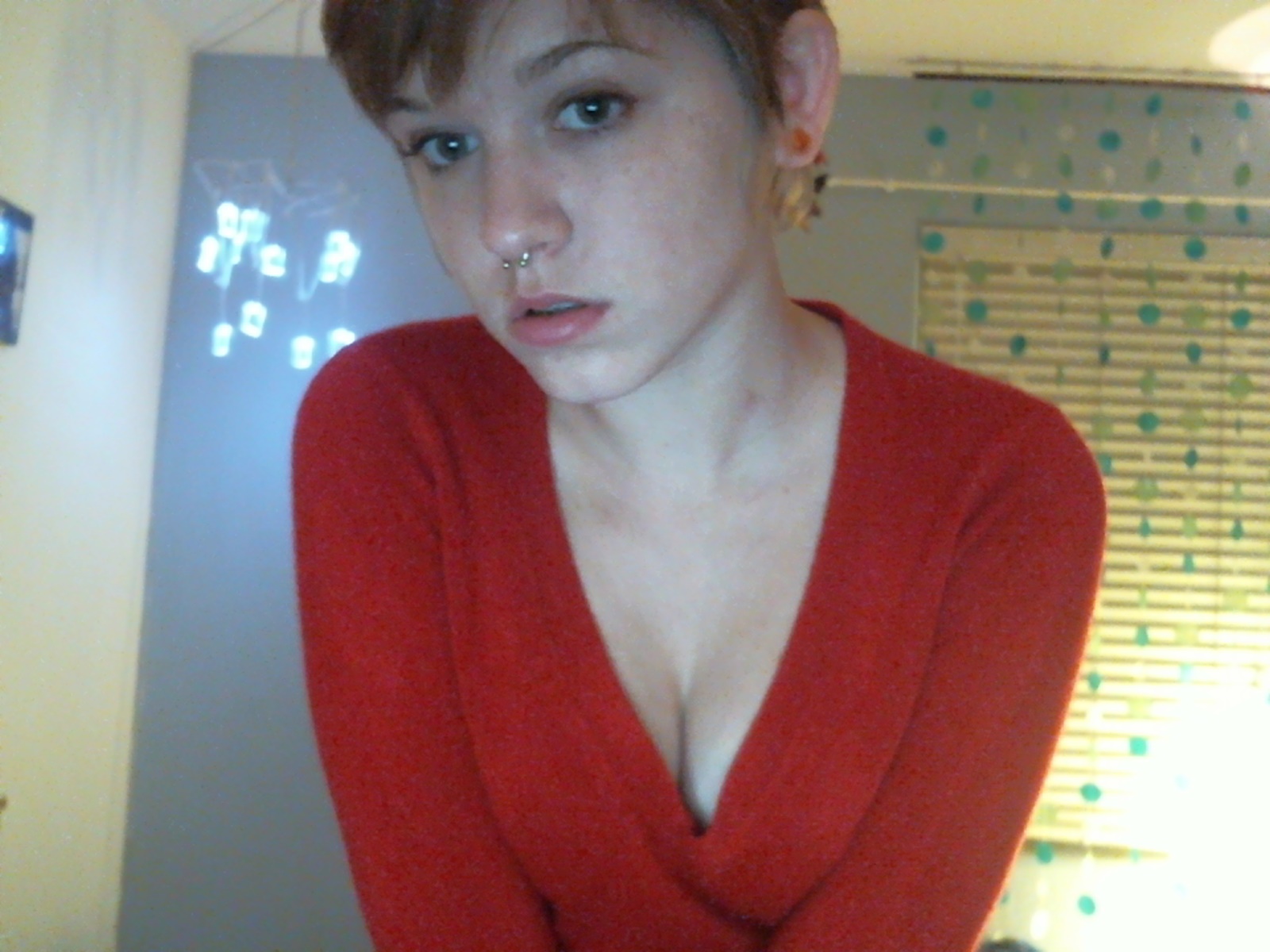 Squeezing her pretty boobies with hands in the red shirt | Scrolller